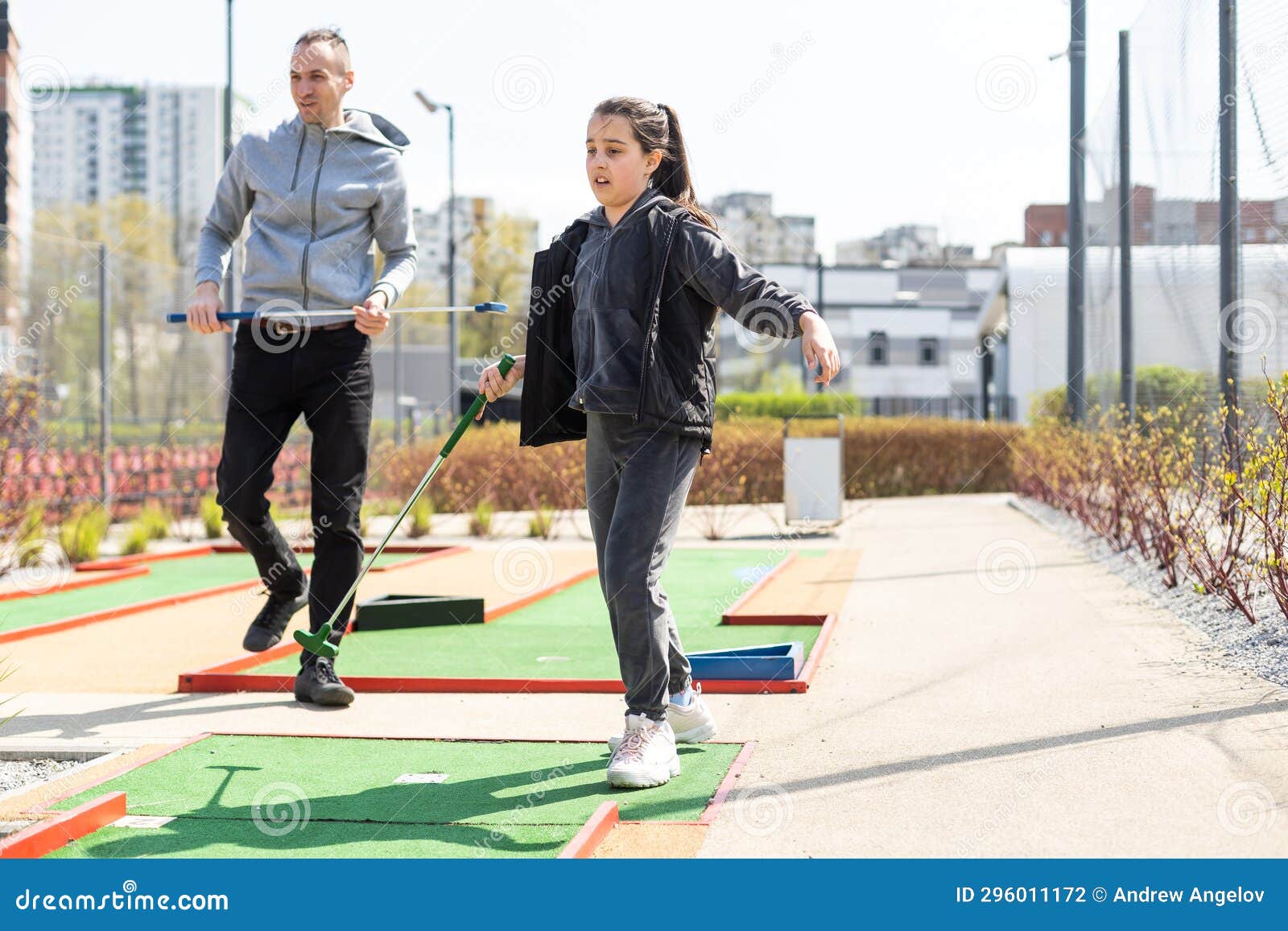 Family Time Playing Mini-Golf in the Summer Stock Photo - Image of cute ...