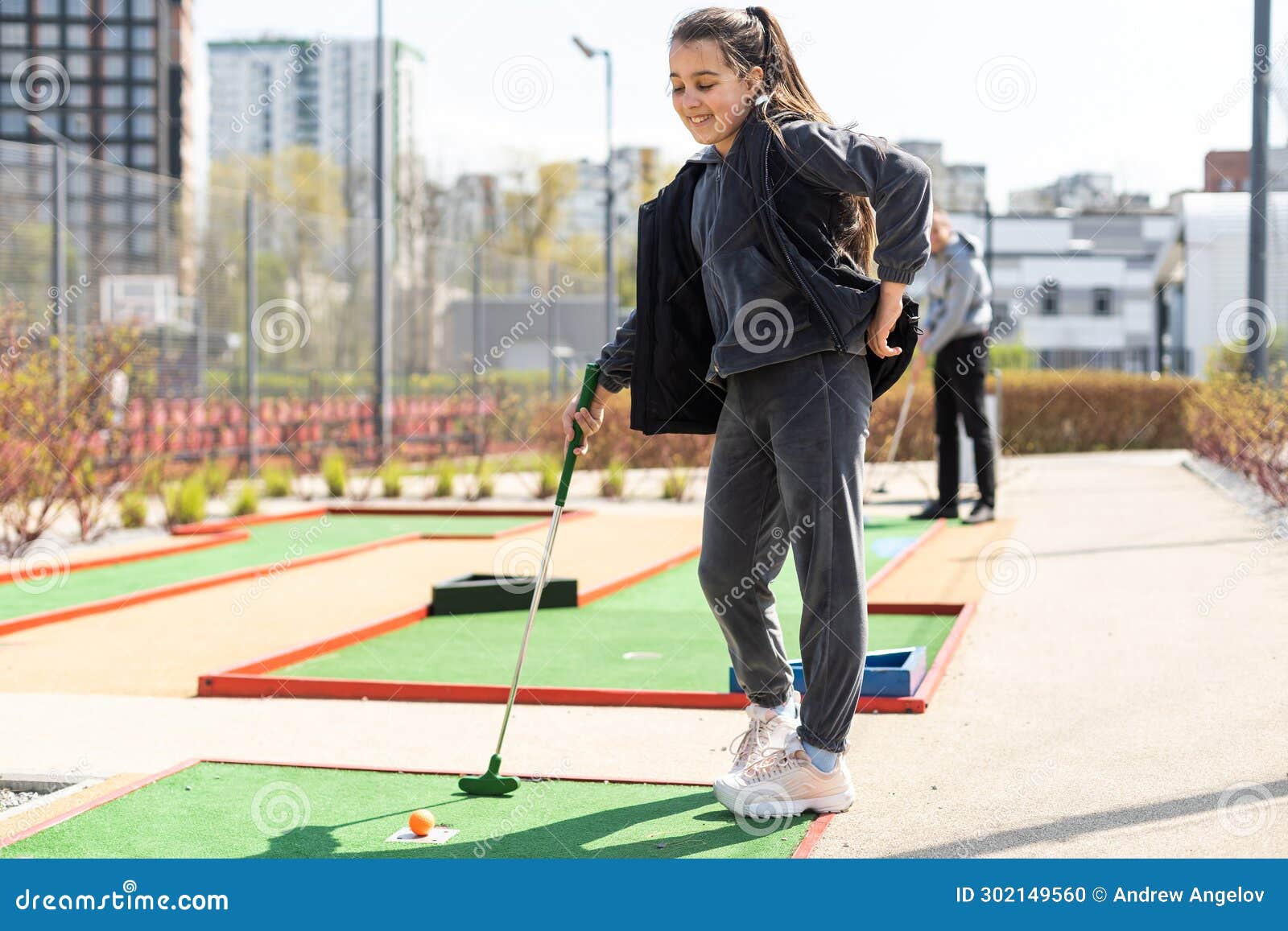 Family Time Playing Mini-Golf in the Summer Stock Photo - Image of mini ...