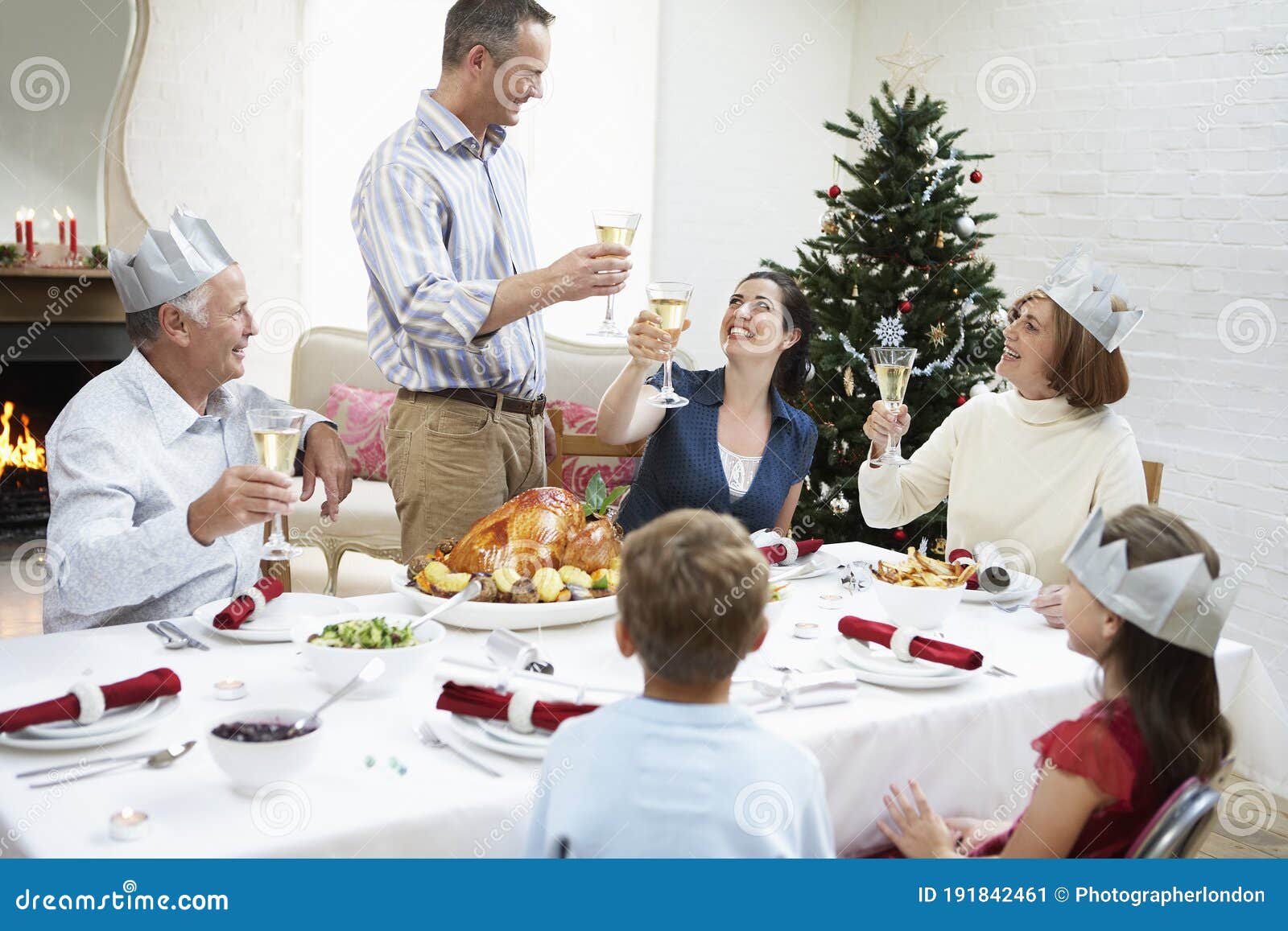 Family Toasting at Table at Christmas Dinner Stock Image - Image of ...
