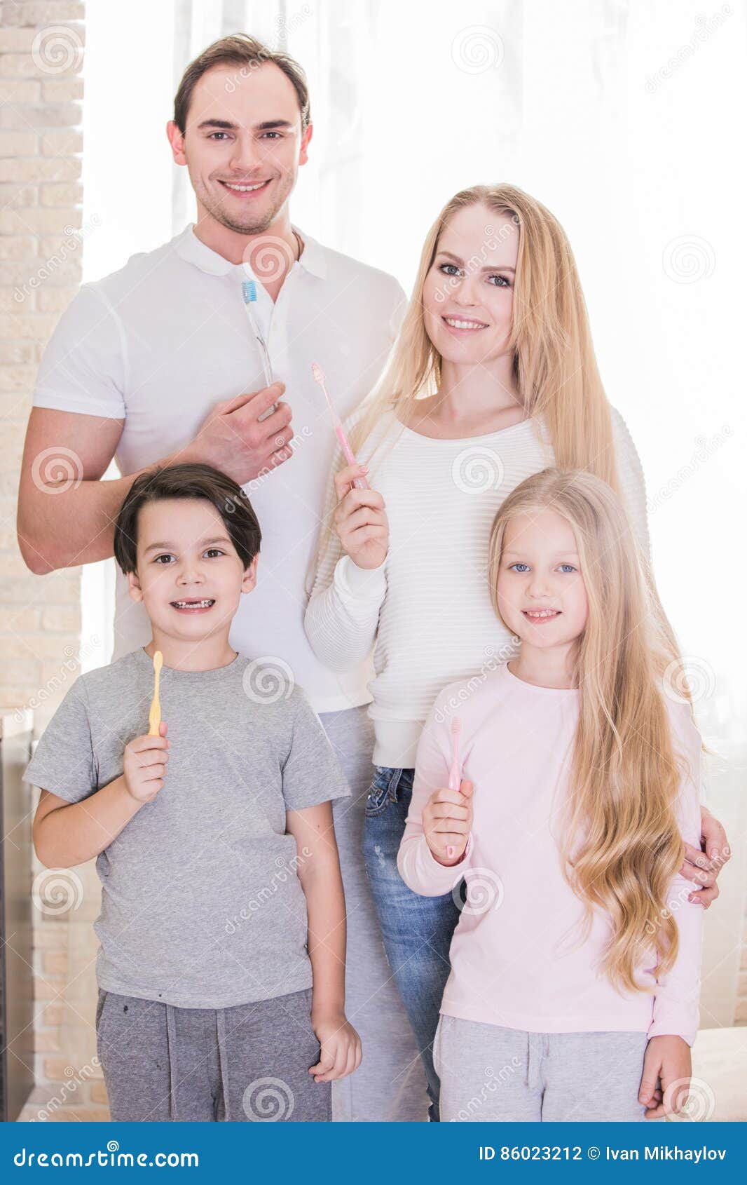 Family with toothbrushes stock photo. Image of together - 86023212