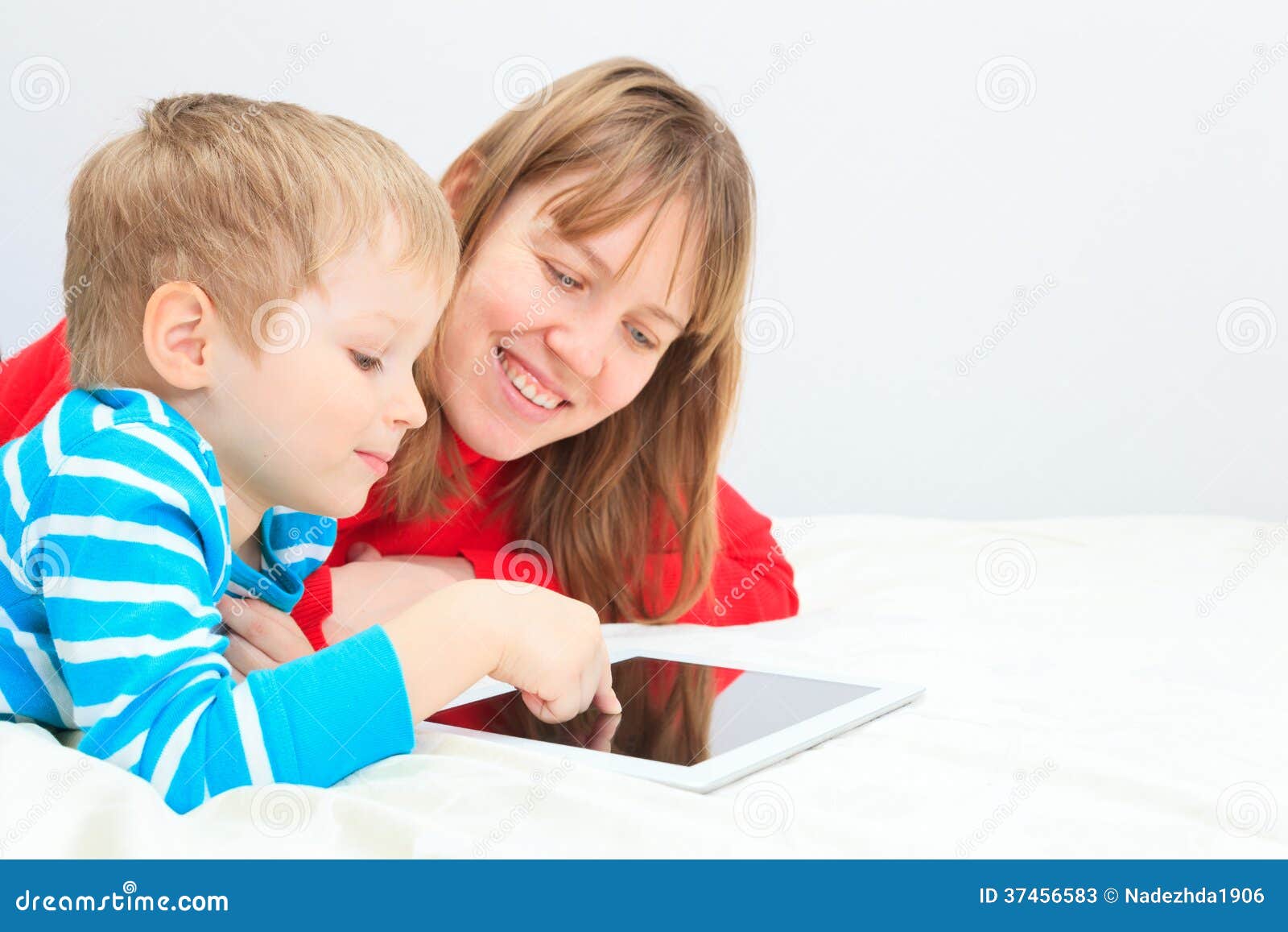 Family with Touch Pad at Home Stock Image - Image of modern, little ...