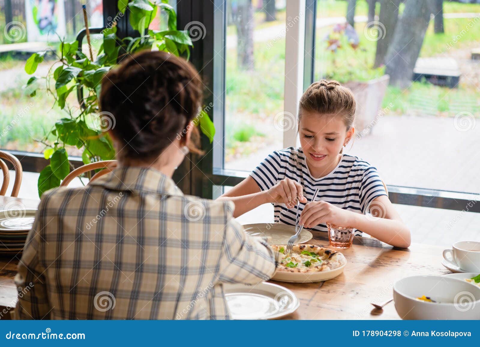 Family of Two Having Lunch at a Cafe Stock Photo - Image of happy, food ...