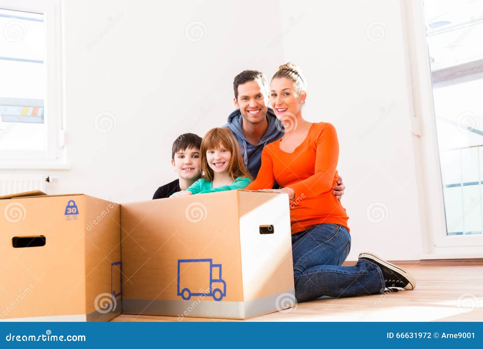 Family Unpacking Moving Boxes in New Home Stock Photo - Image of home ...