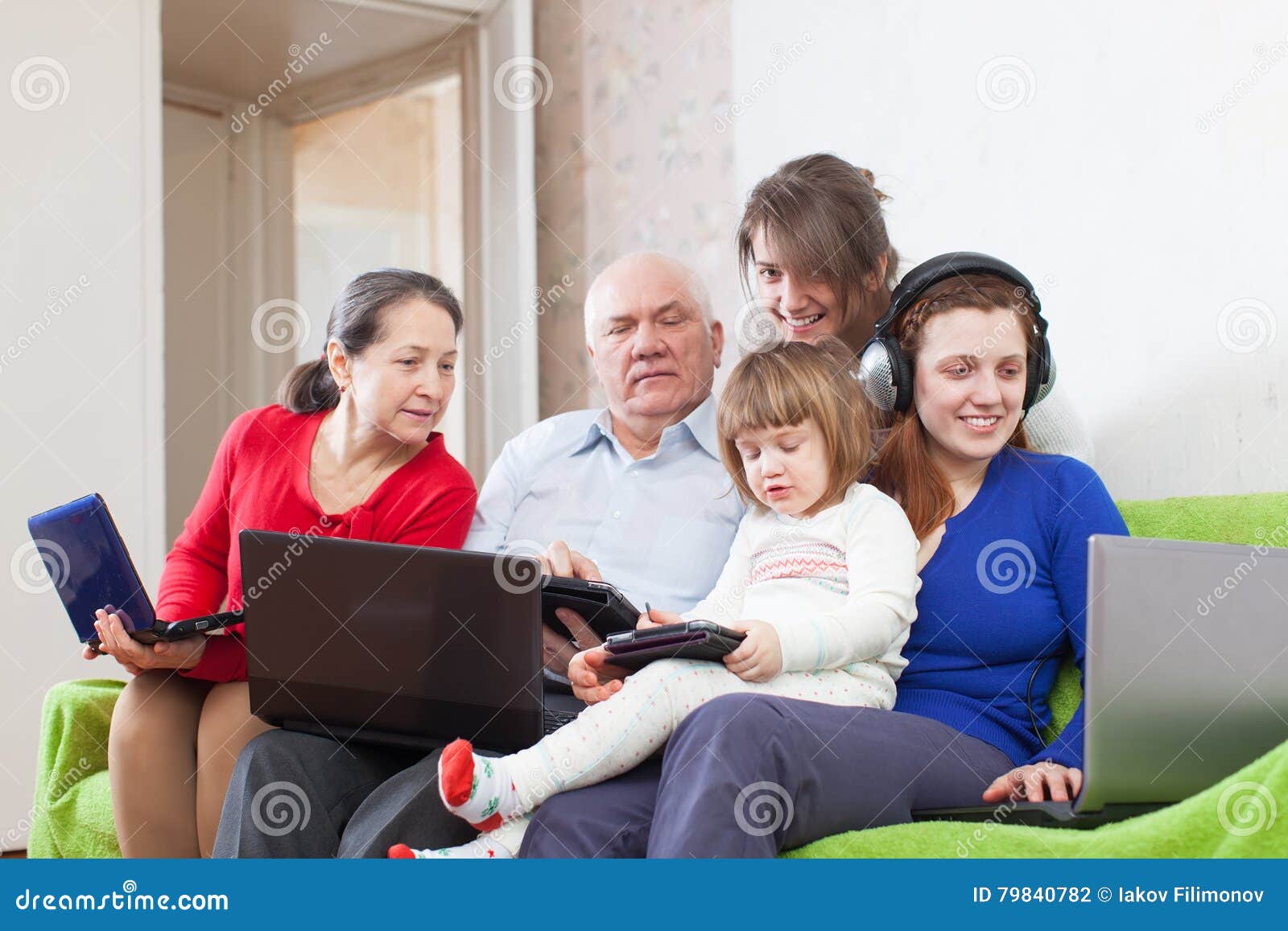 Family Uses Few Various Devices in Home Stock Photo - Image of mature ...