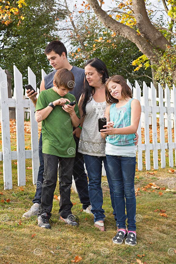 Family using Cellphones stock image. Image of electronics - 27095121