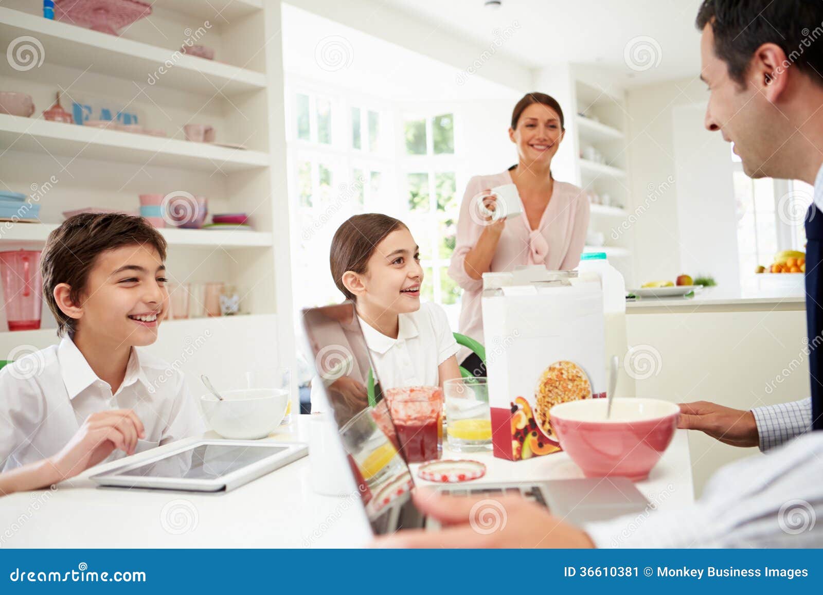 Family Using Digital Devices at Breakfast Table Stock Image - Image of ...