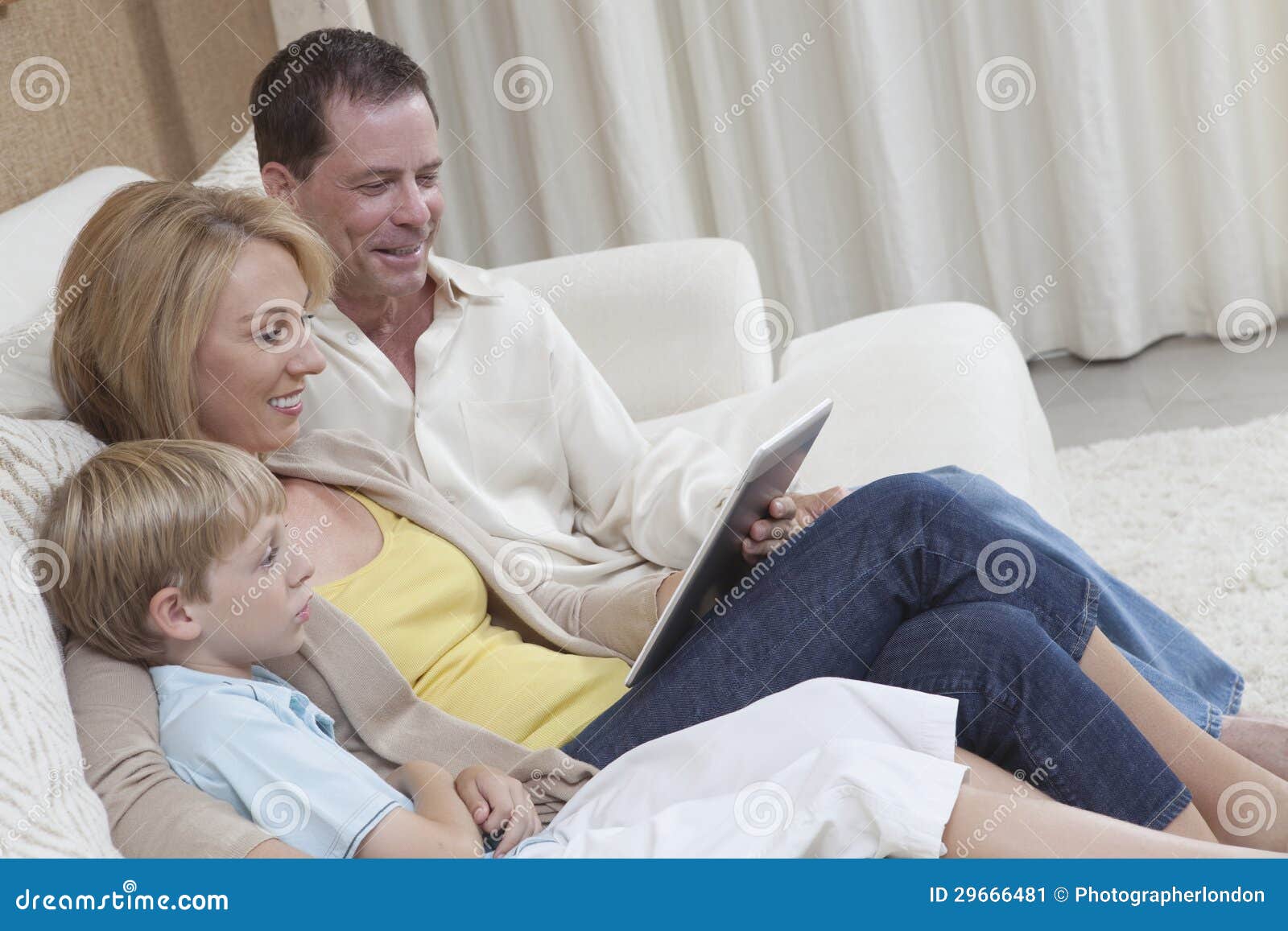 Family Using Digital Tablet Stock Image - Image of couch, family: 29666481