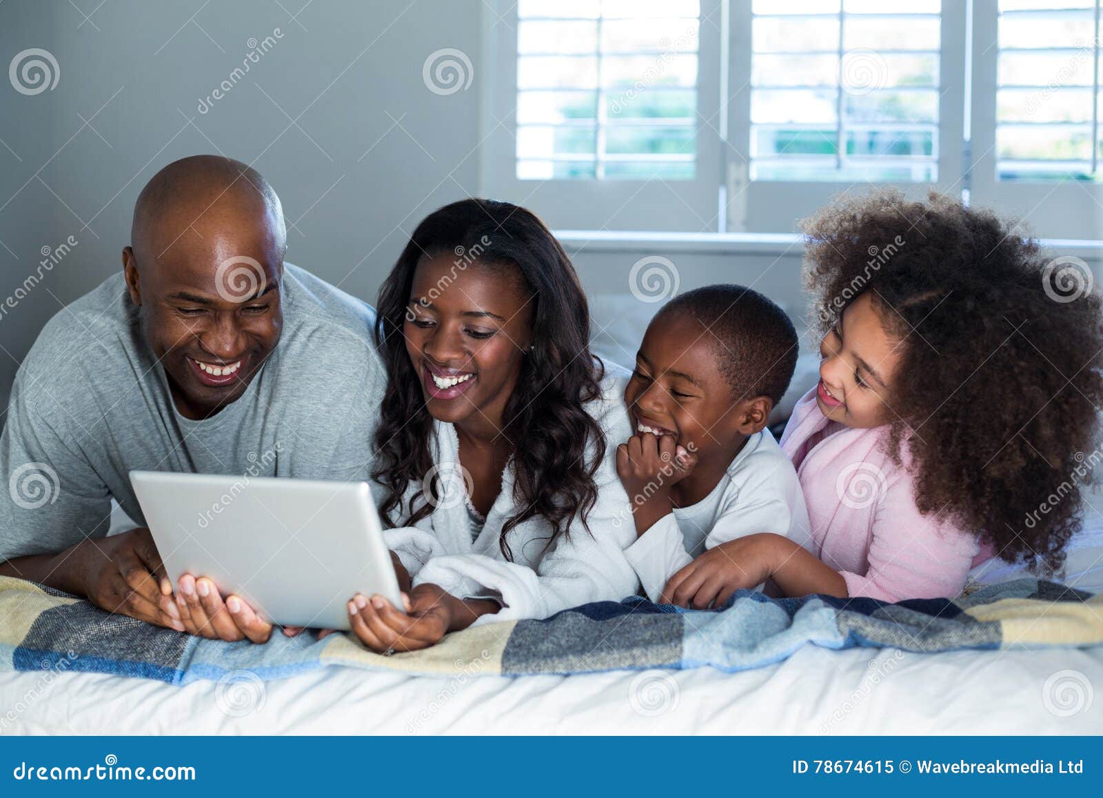 Family Using Digital Tablet on Bed Stock Image - Image of domicile ...