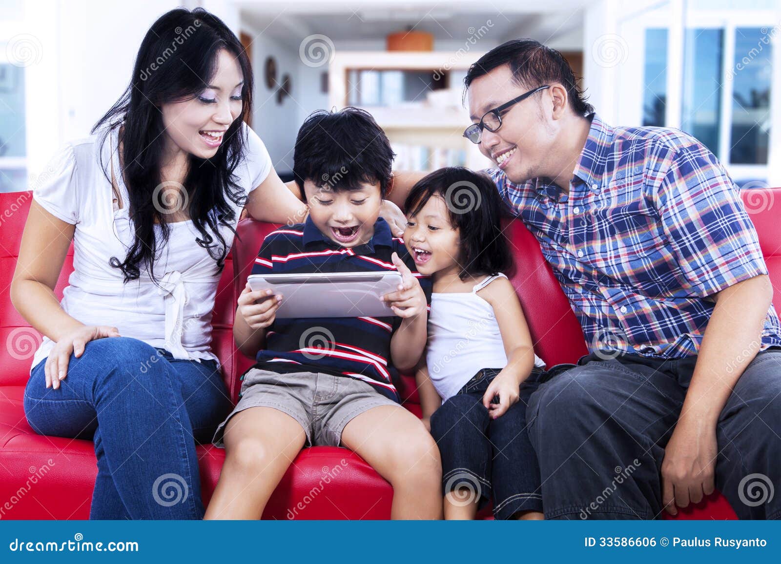 Family Using Digital Tablet Stock Photo - Image of electronic, looking: 33586606