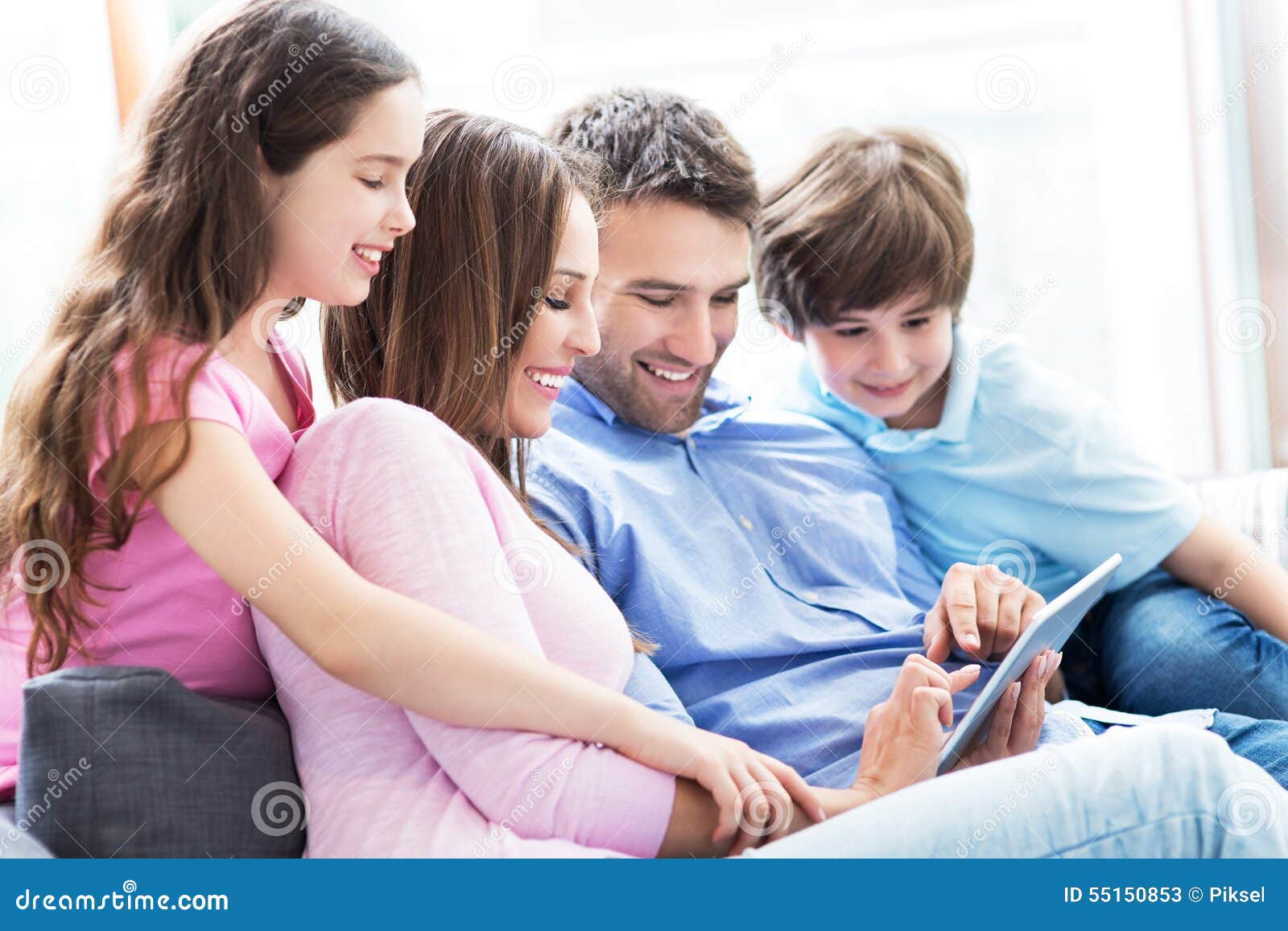 Family Using Digital Tablet at Home Stock Image - Image of bonding ...