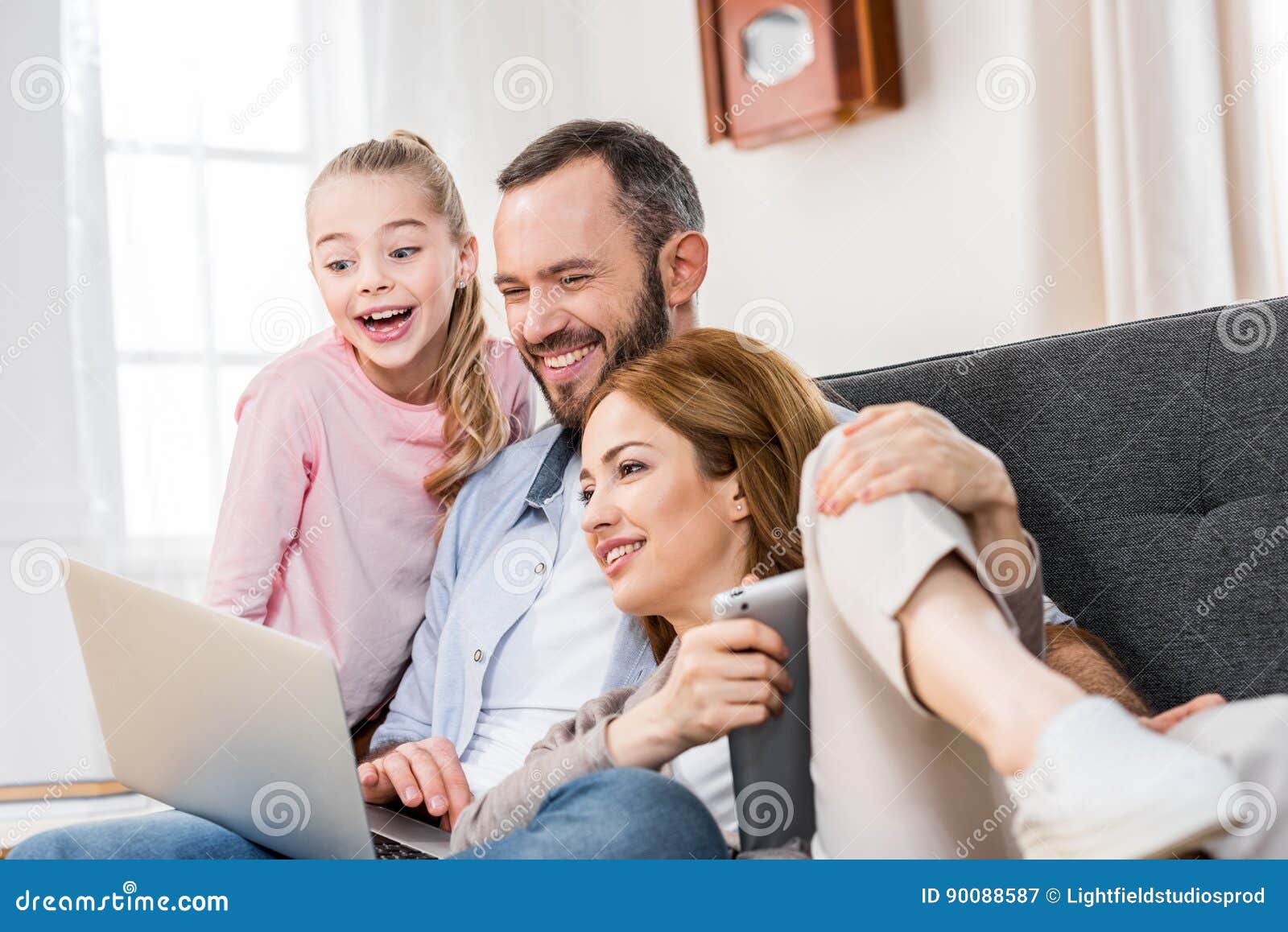 Family using laptop stock image. Image of excited, hugging - 90088587