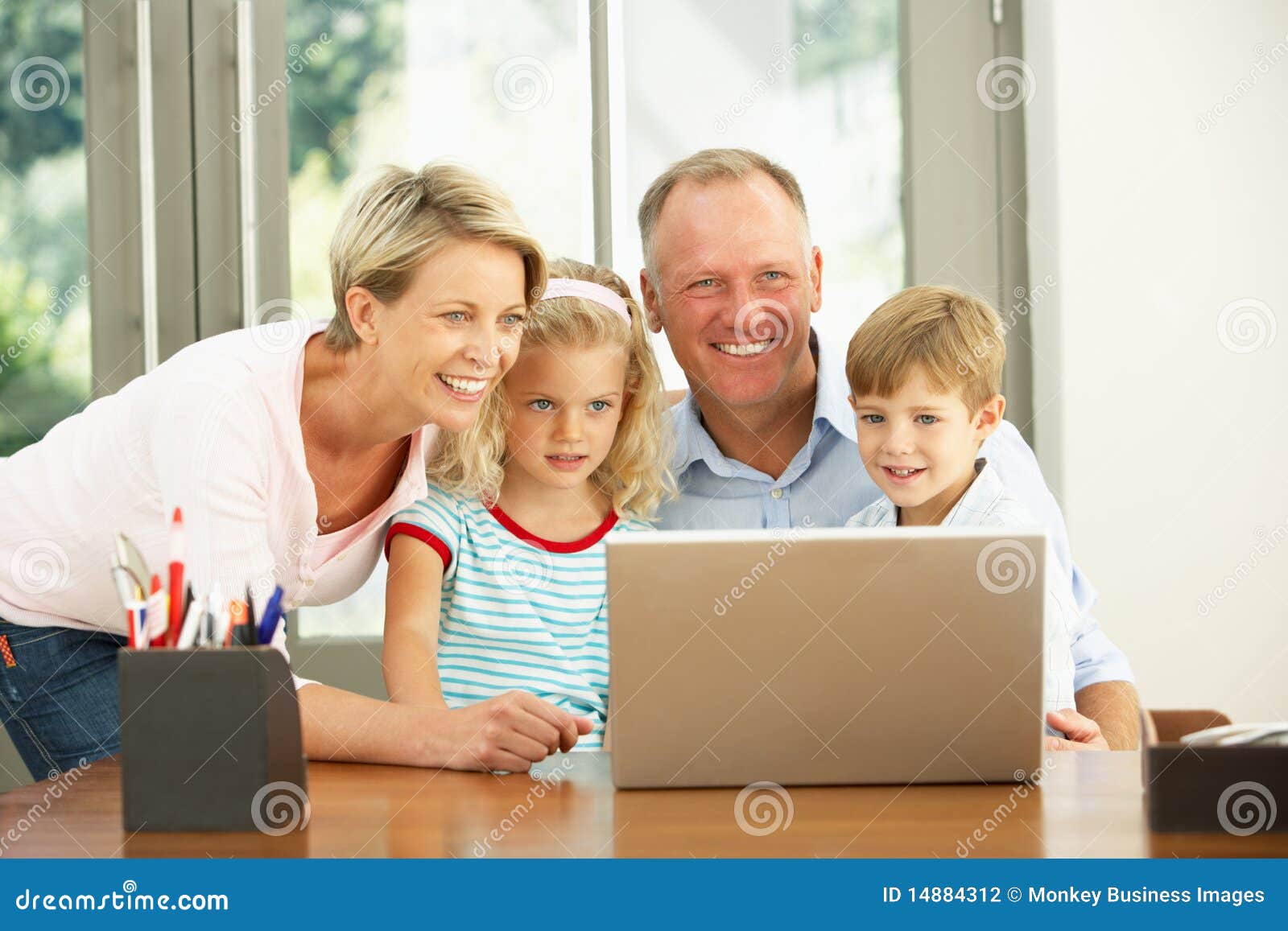 Family Using Laptop at Home Stock Photo - Image of camera, child: 14884312