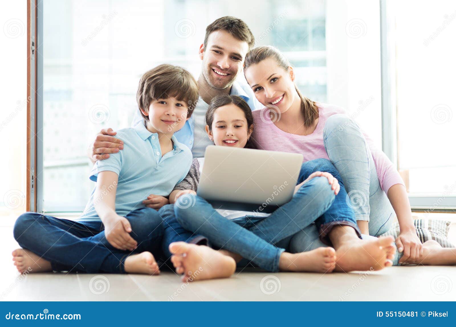 Family Using Laptop at Home Stock Image - Image of computer, cozy: 55150481