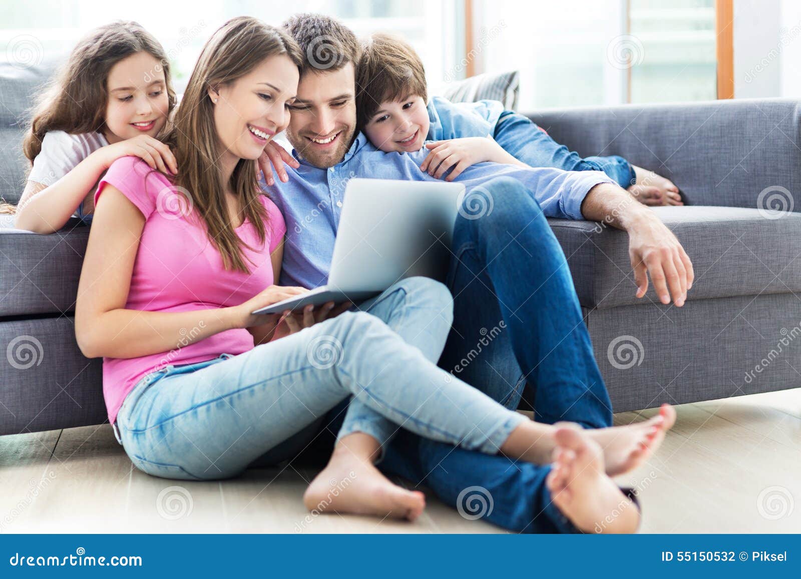 Family Using Laptop at Home Stock Photo - Image of brother, comfortable ...