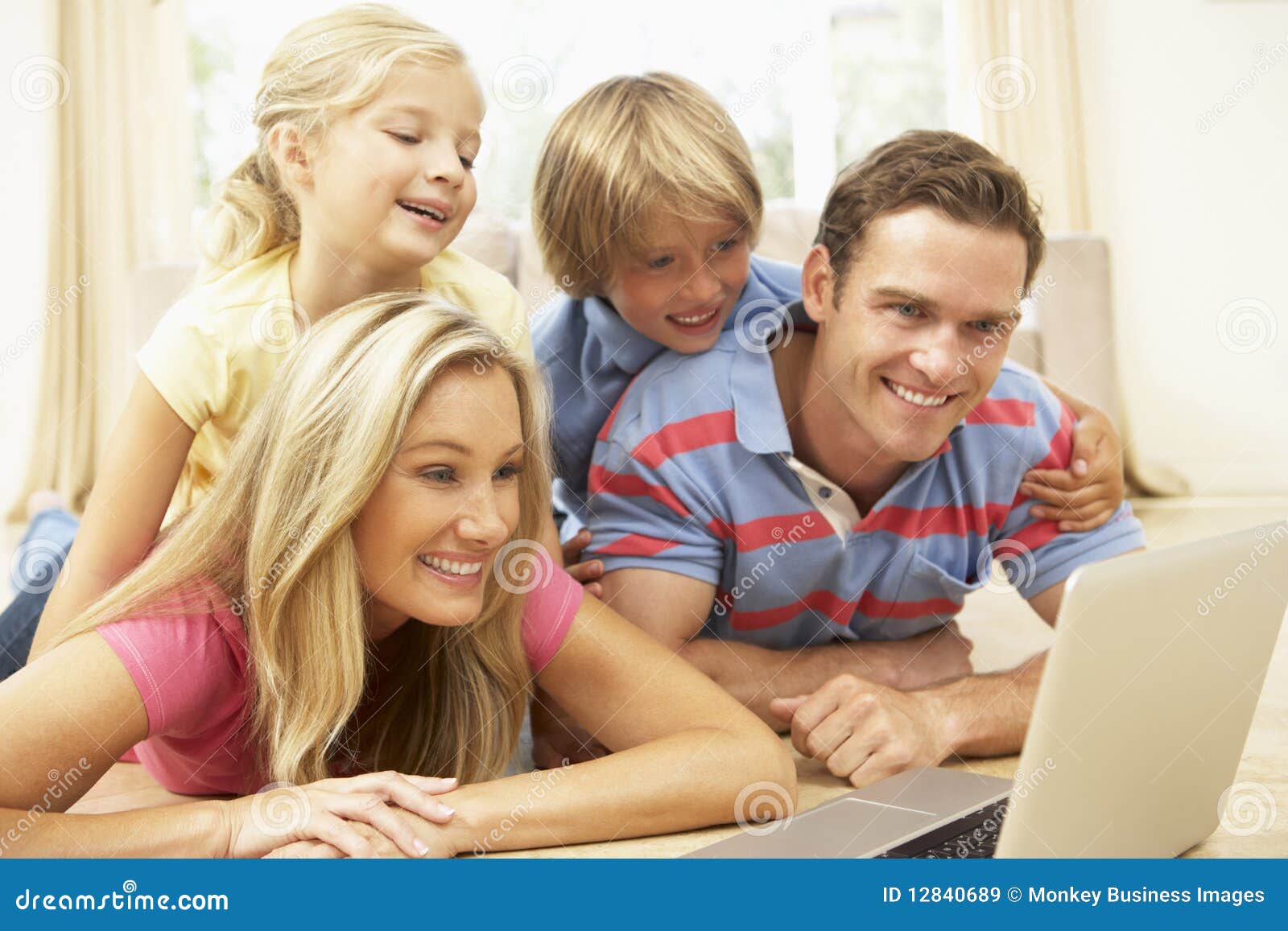 Family Using Laptop at Home Together Stock Image - Image of laptop ...