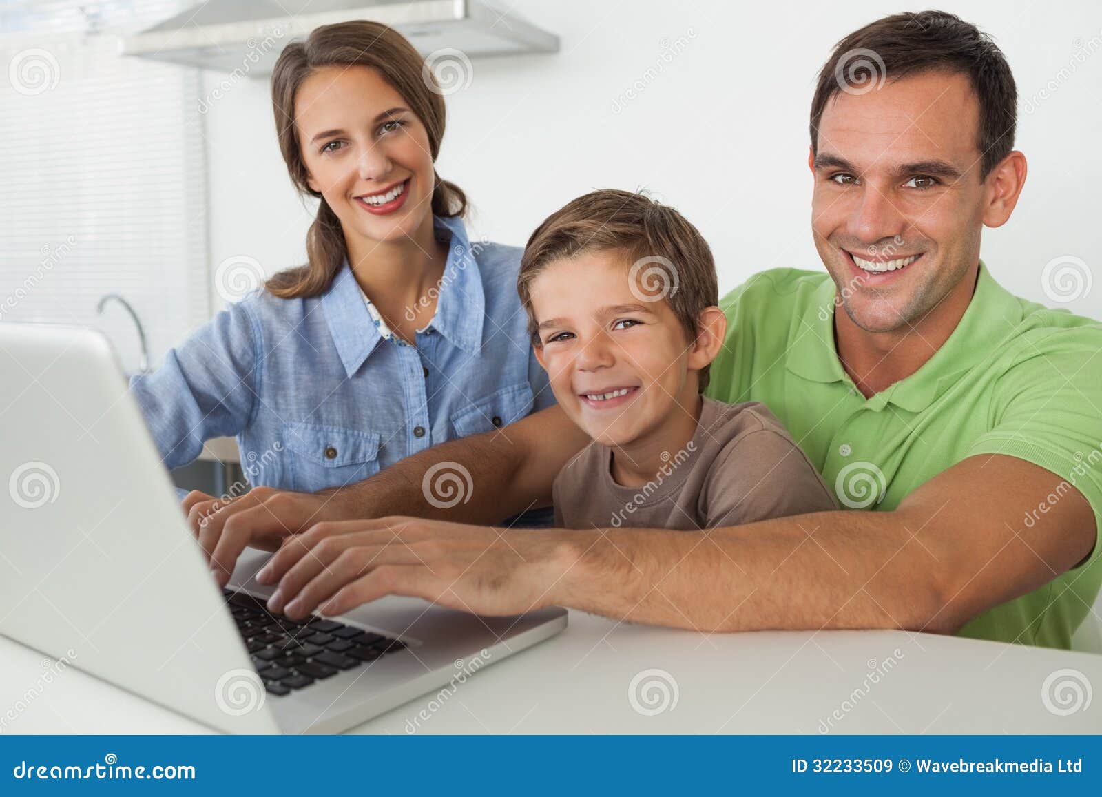 Family Using a Laptop in the Kitchen Stock Image - Image of house ...