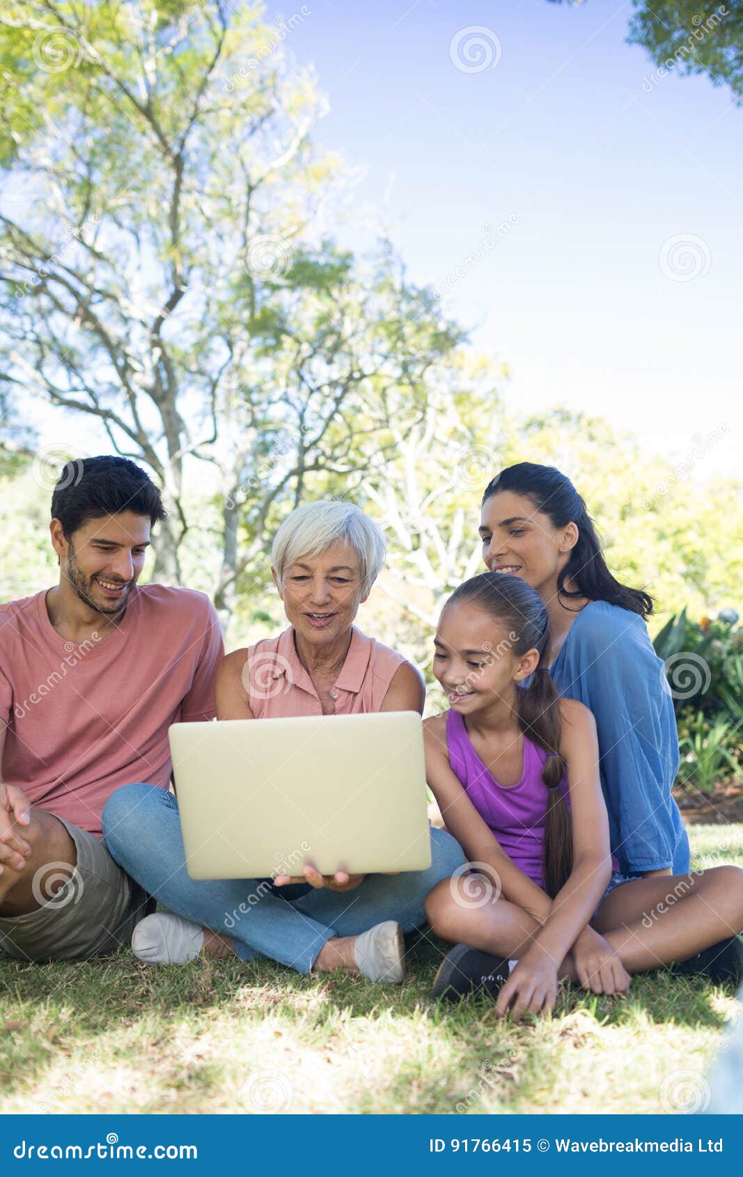 Family Using Laptop in the Park Stock Image - Image of adult ...