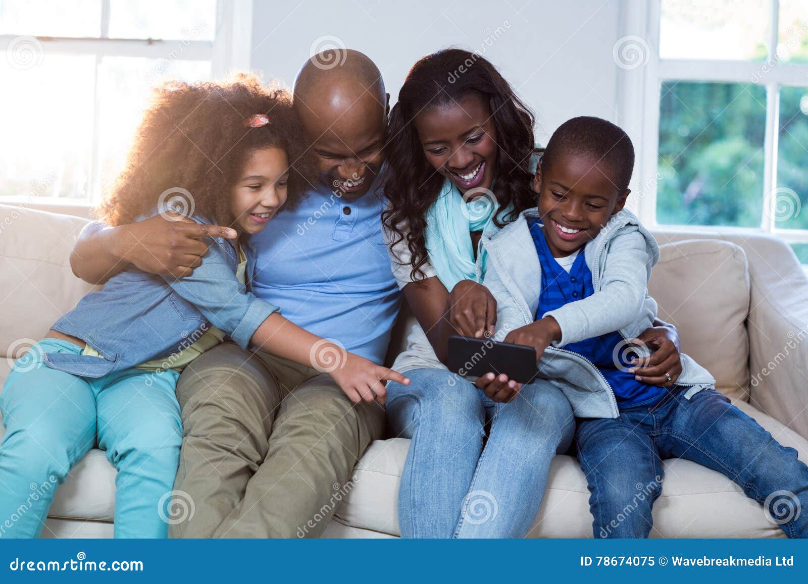 Family using mobile phone stock image. Image of cheerful - 78674075