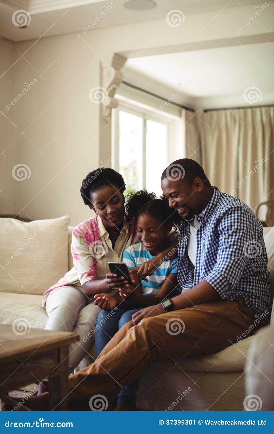 Family Using Mobile Phone in Living Room Stock Image - Image of leisure ...