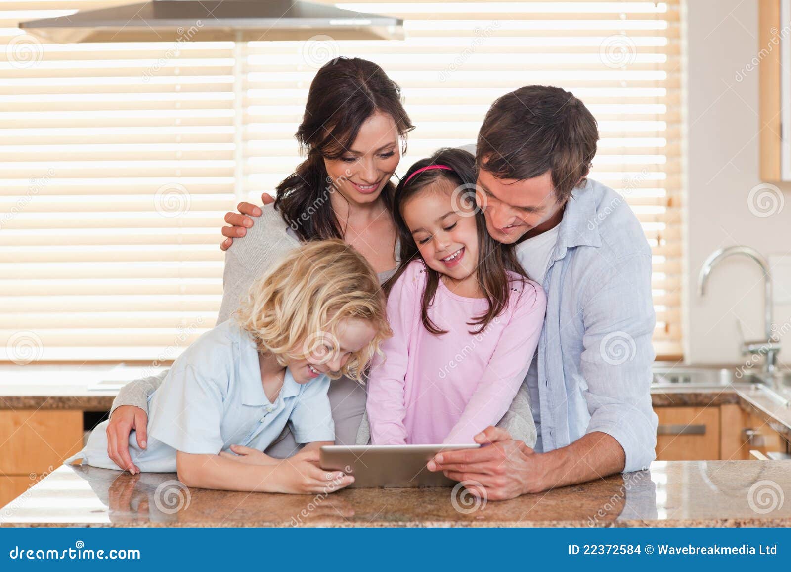 Family Using a Tablet Computer Together Stock Photo - Image of ...