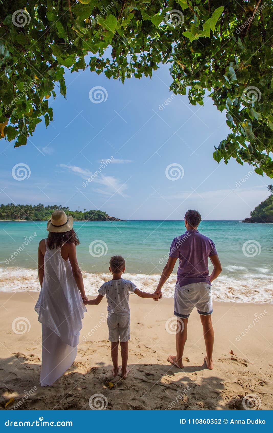 Family on Vacation at the Seashore of Indian Ocean Stock Photo - Image ...