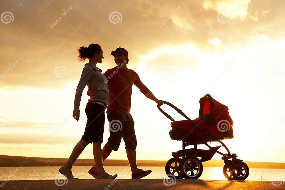 Family walk at sunset stock photo. Image of love, lifestyles - 20636566
