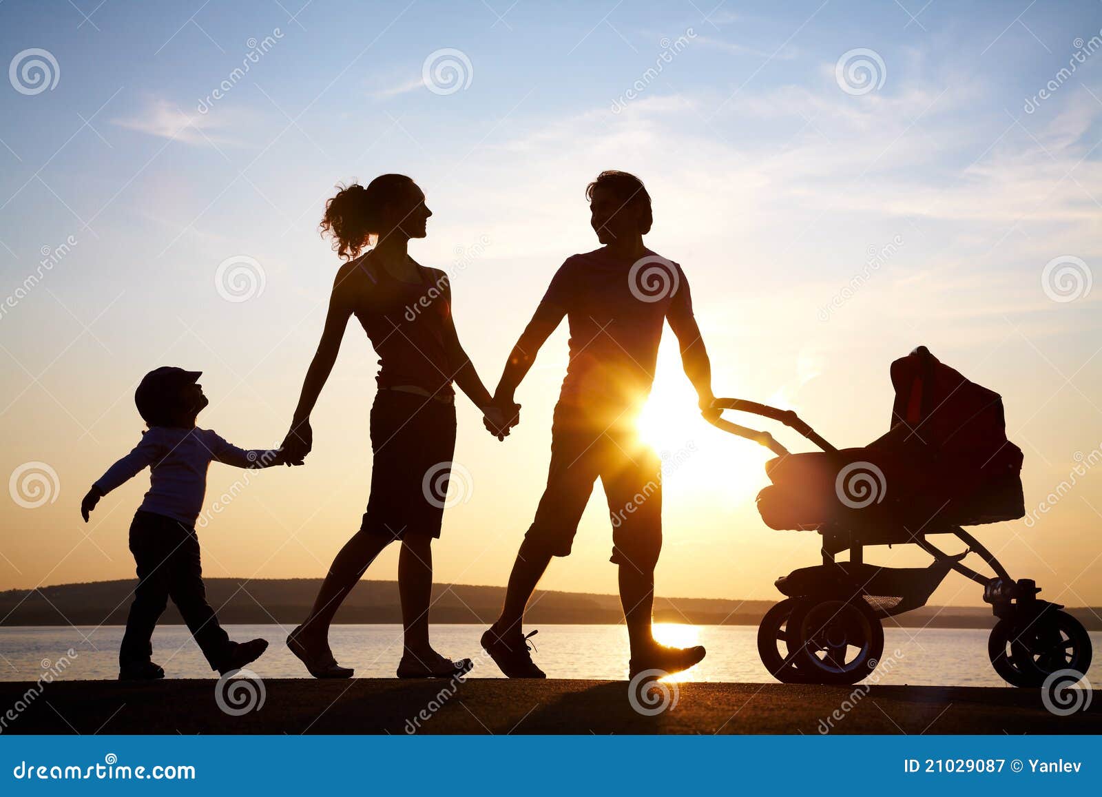 Family walk at sunset stock image. Image of parents, people - 21029087