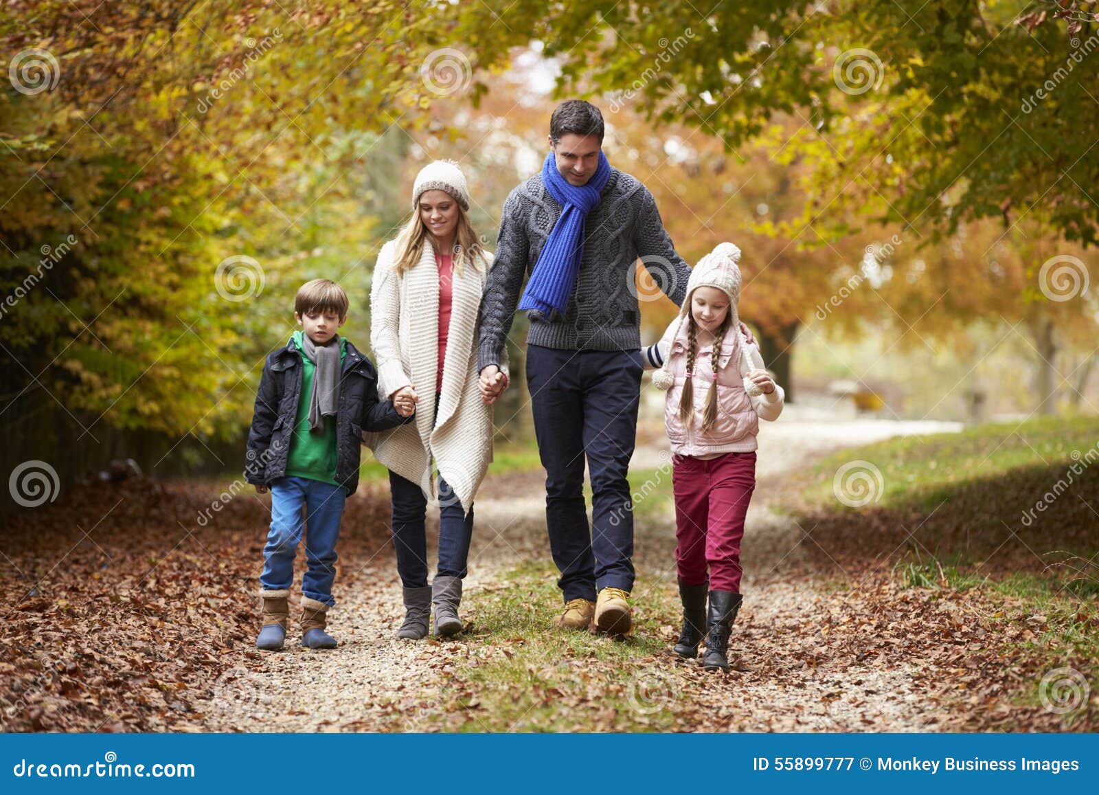 Family Walking Along Autumn Path Stock Image - Image of person, park ...