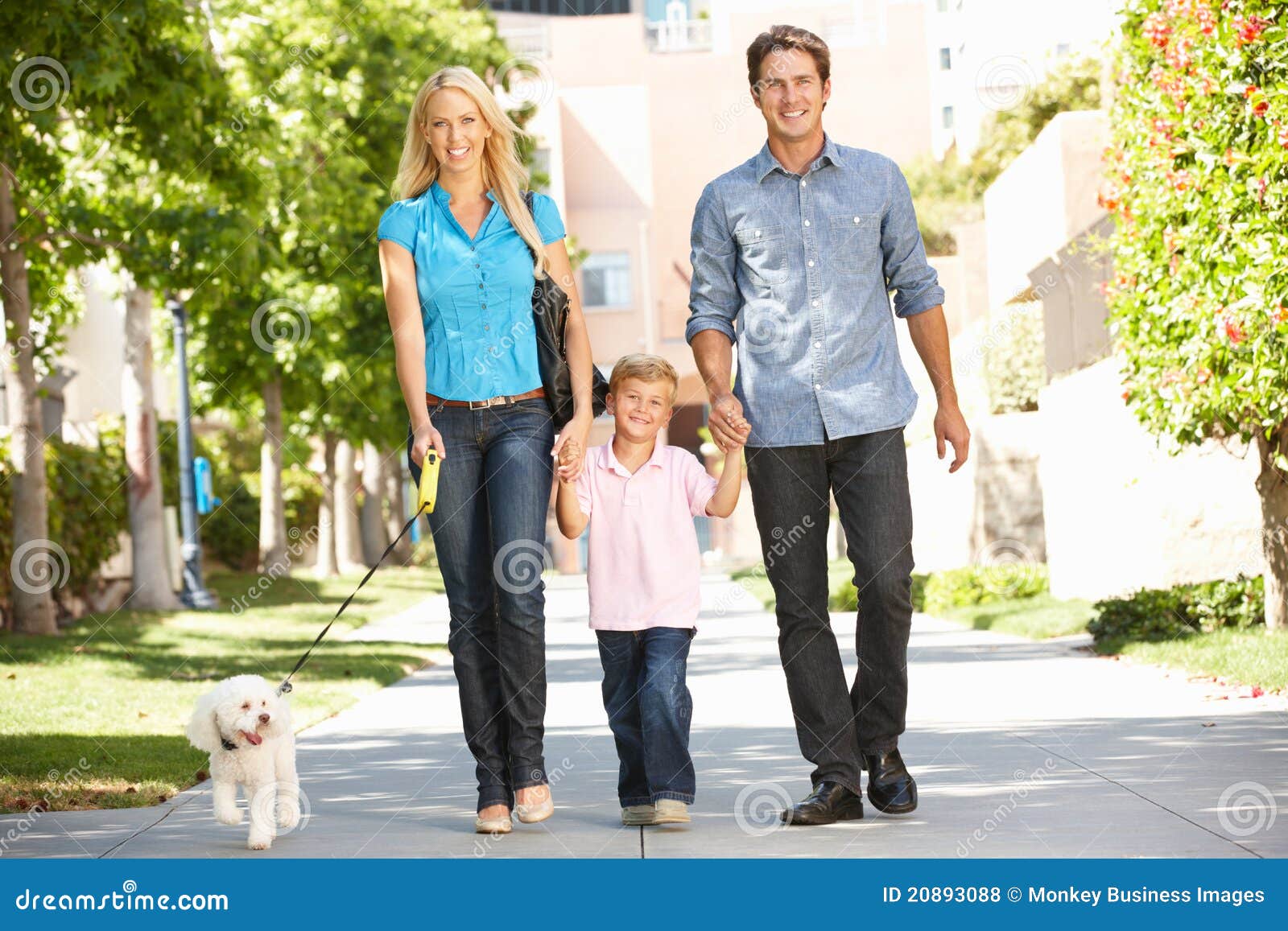 Family Walking Down the Street with Dog Stock Photo - Image of ...