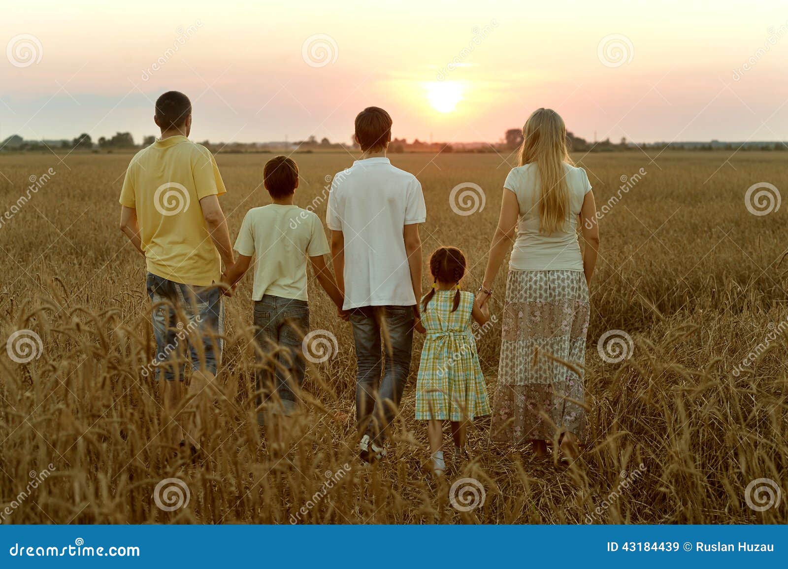 Family walking in field stock image. Image of outdoors - 43184439