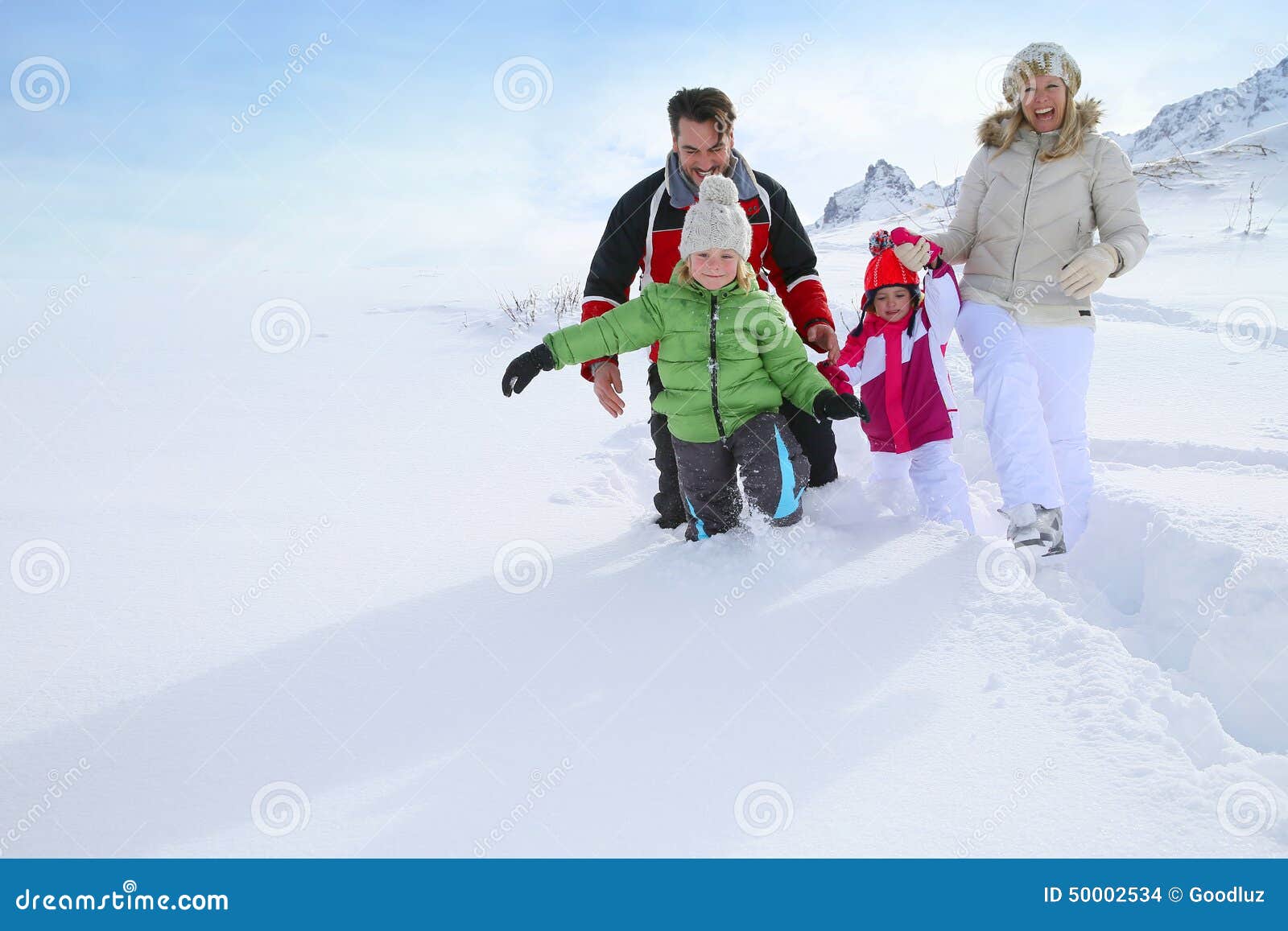 Family Walking in Fresh Snow Stock Photo - Image of alps, resort: 50002534