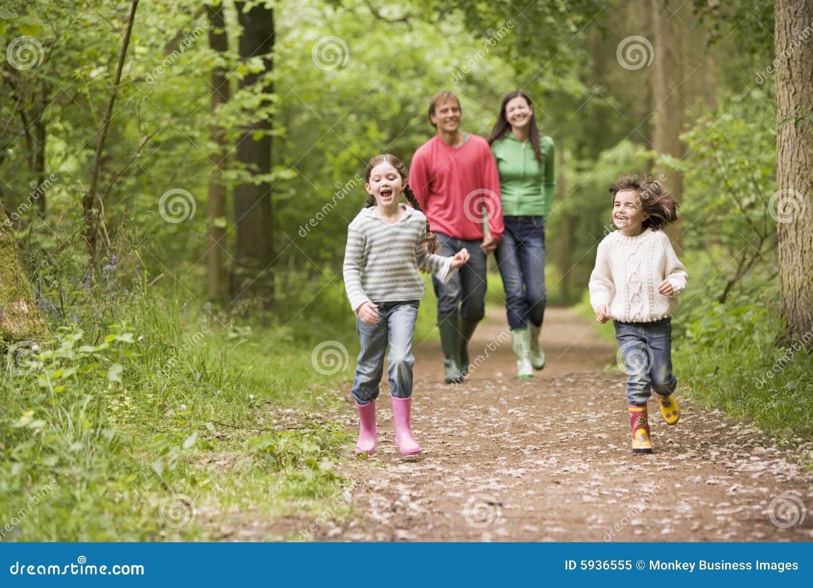Family Walking on Path Holding Hands Smiling Stock Image - Image of ...
