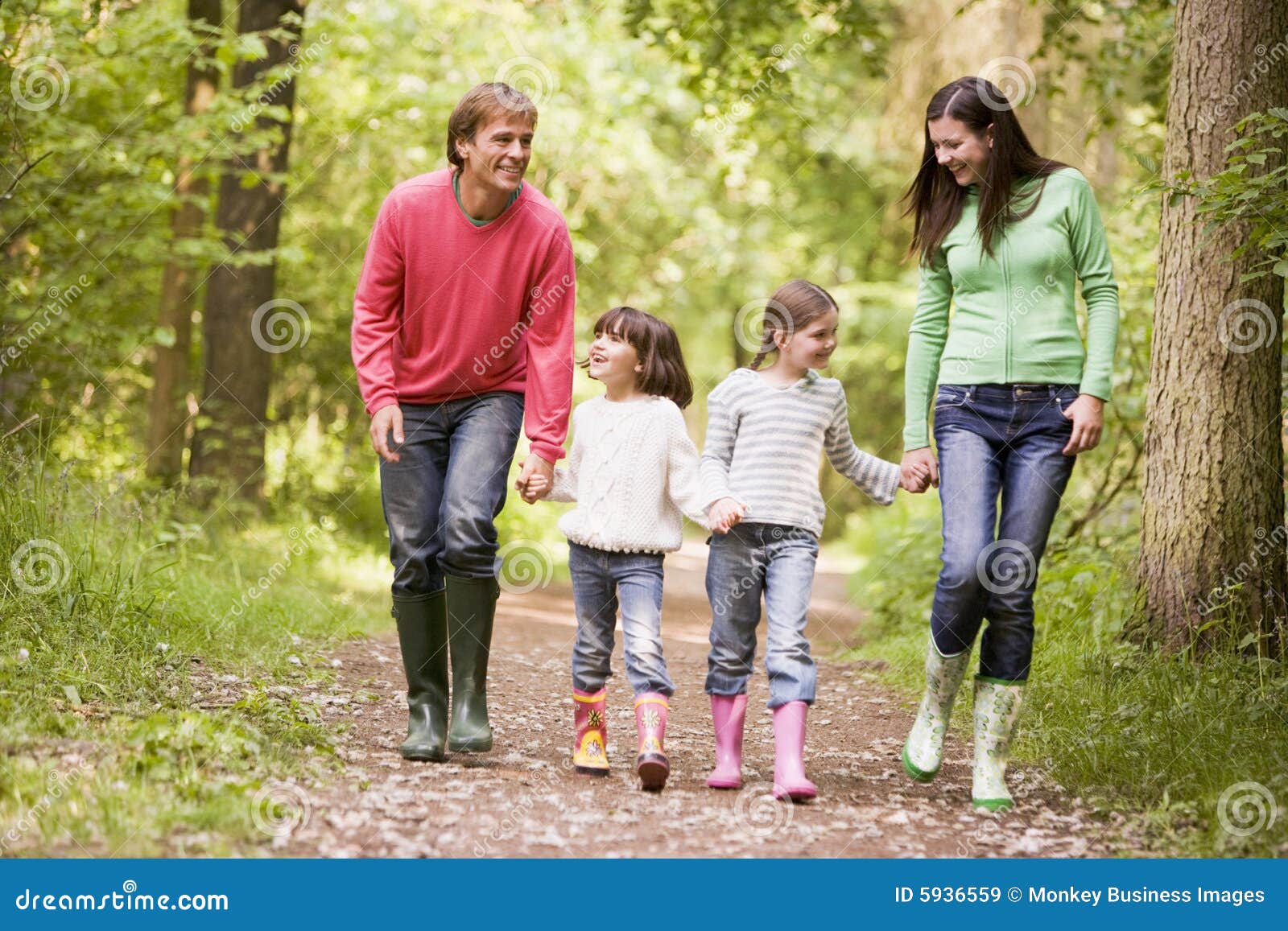 Family Walking On Path Holding Hands Smiling Royalty Free Stock Images ...