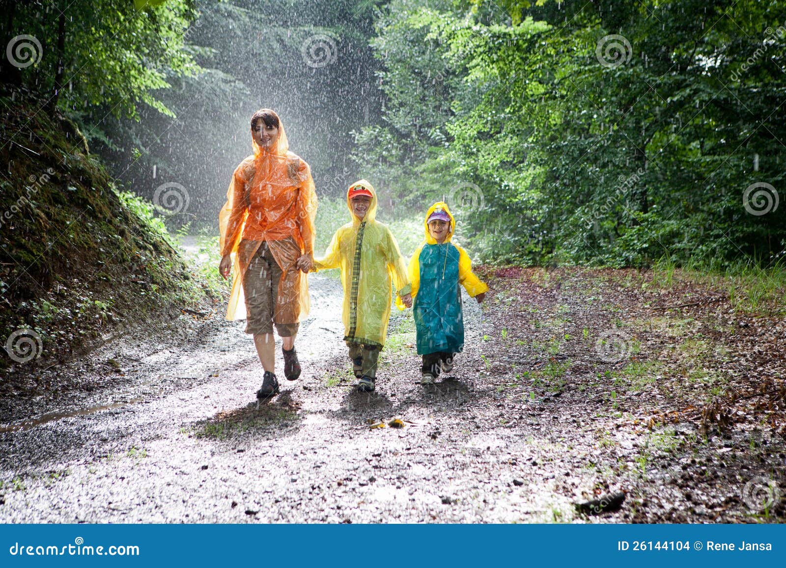Family walking in the rain stock photo. Image of group - 26144104