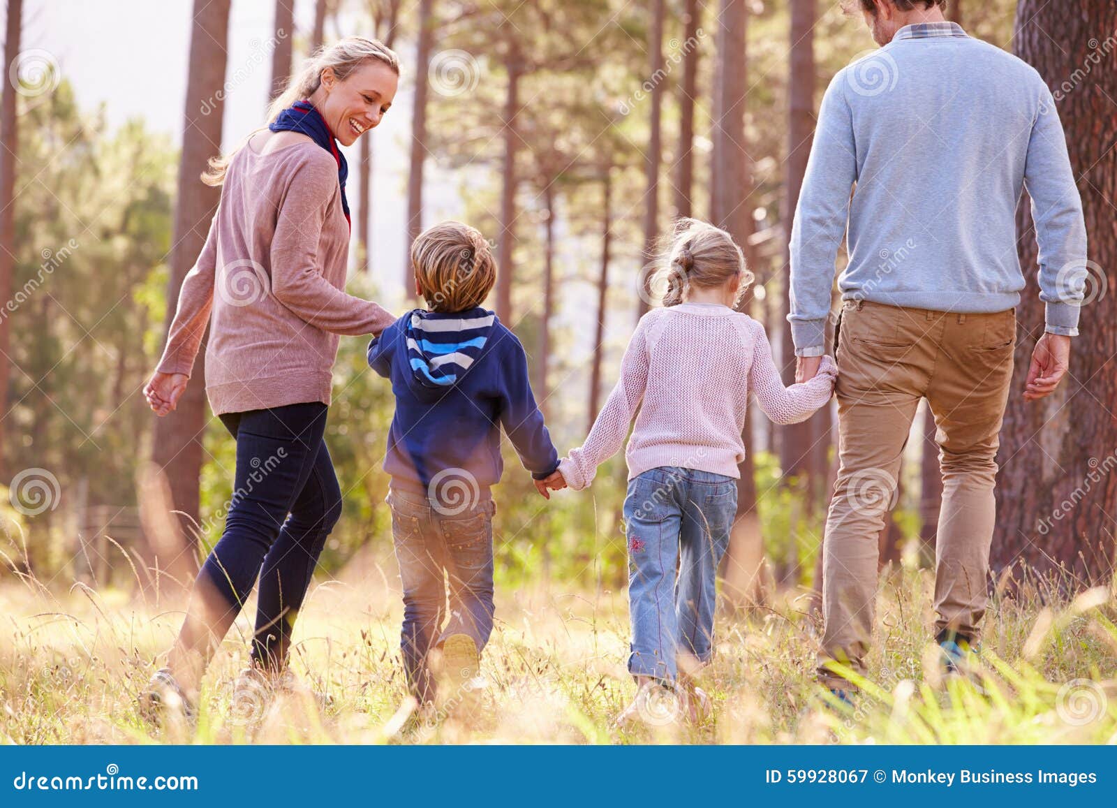 A Family Walking Down The Canal Footpath By The Narrowboats Stock Image ...