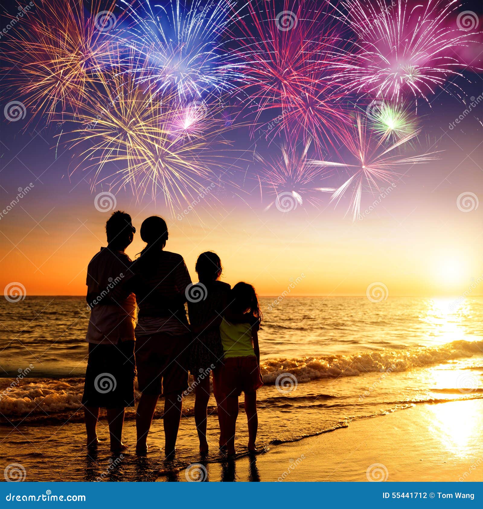 Family Watching the Sunset and Firework on the Beach Stock Photo ...