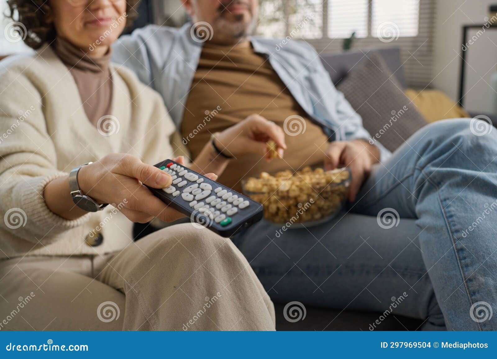 Family watching TV at home stock photo. Image of leisure - 297969504