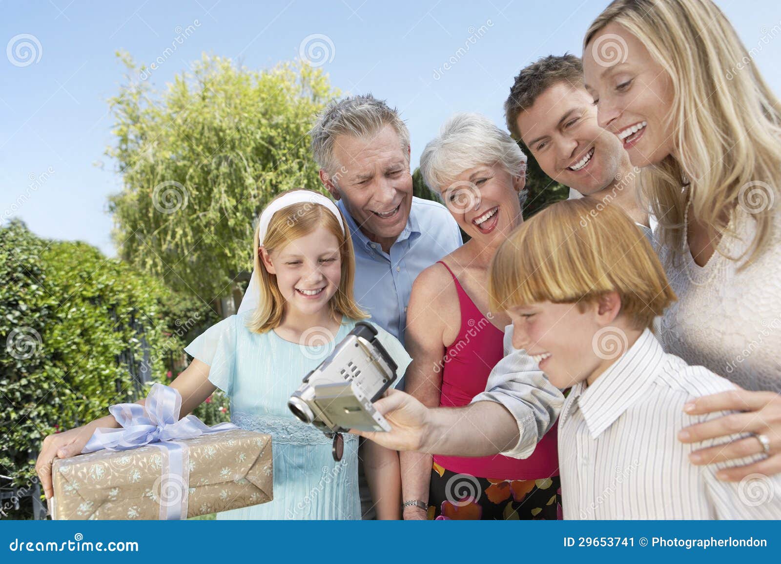 Family Watching Video Together Stock Image - Image of enjoying, middle ...