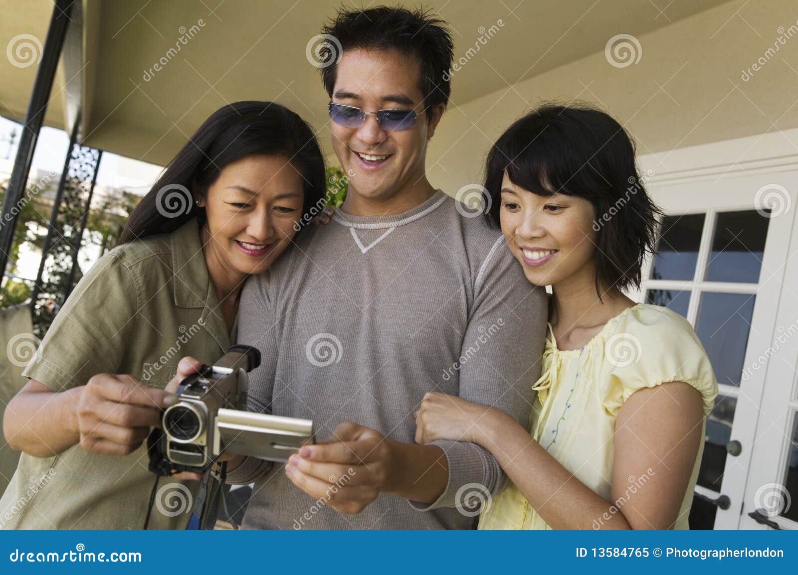 Family Watching Video on Video Camera Stock Image - Image of showing ...