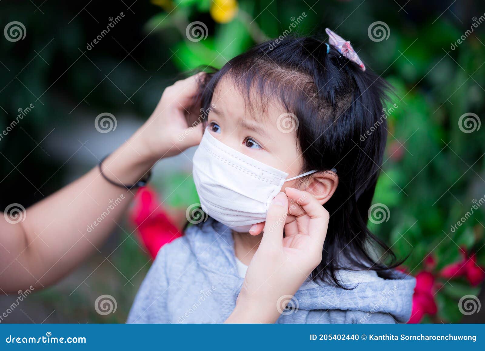 A Frowned Man In Medical Gauze Mask Standing On Dark Red Background ... A Frowned Man In Medical Gauze Mask Standing On Dark Red Background ...