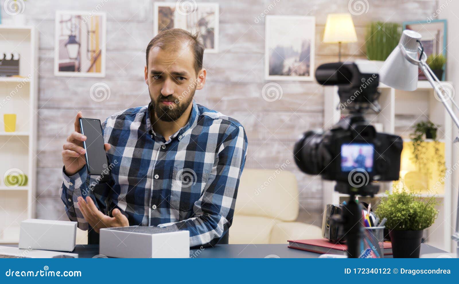 Famous Vlogger Filming the Unboxing of a Phone Stock Photo - Image of ...