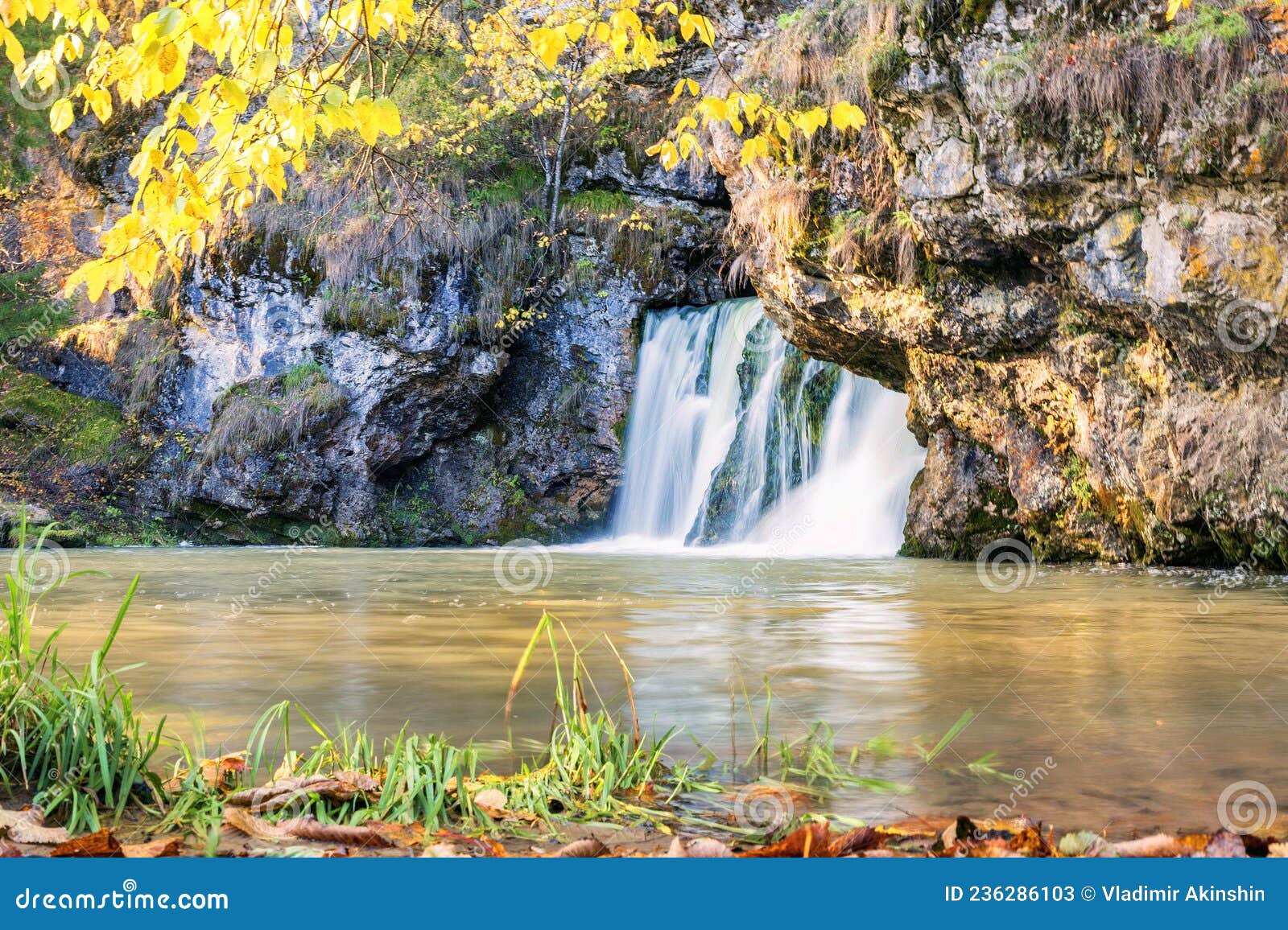 The Famous Waterfall Atysh Flowing from a Karst Funnel in the Ural ...