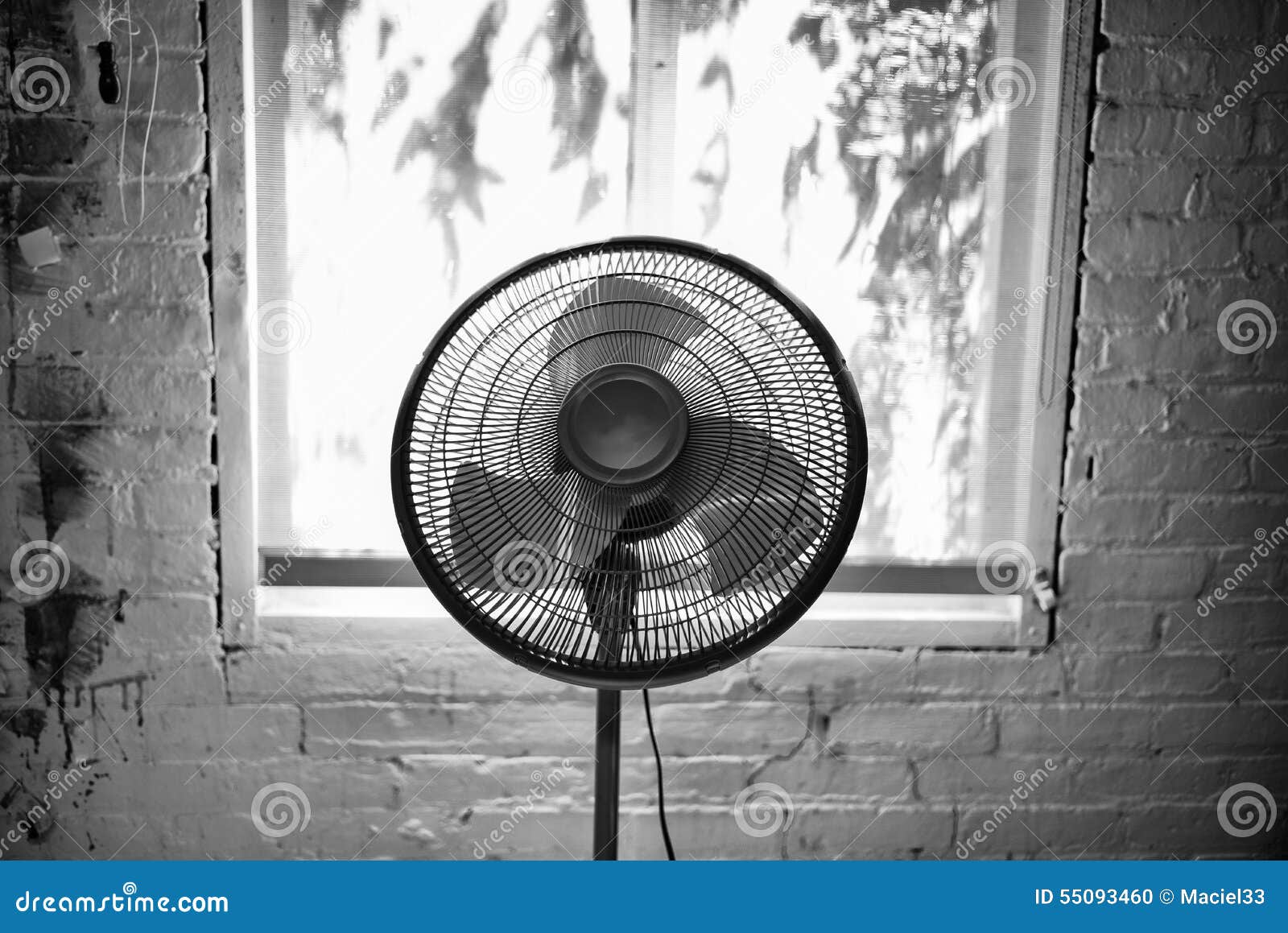 Fan against backlit window stock photo. Image of electricity - 55093460