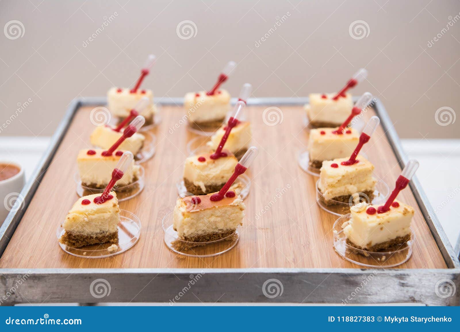 Fancy Beautiful Mini Cakes on Wooden Plate on Even Snack Table Stock ...