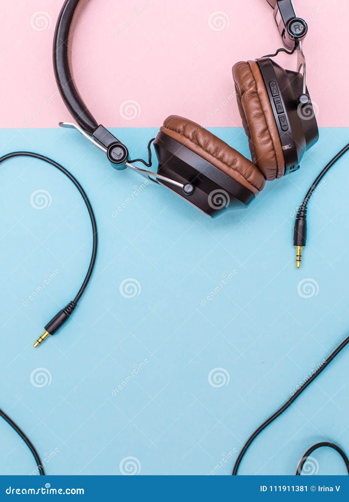 Fancy Headphones Laying on a Flat Pink and Blue Surface. Analog Wire ...