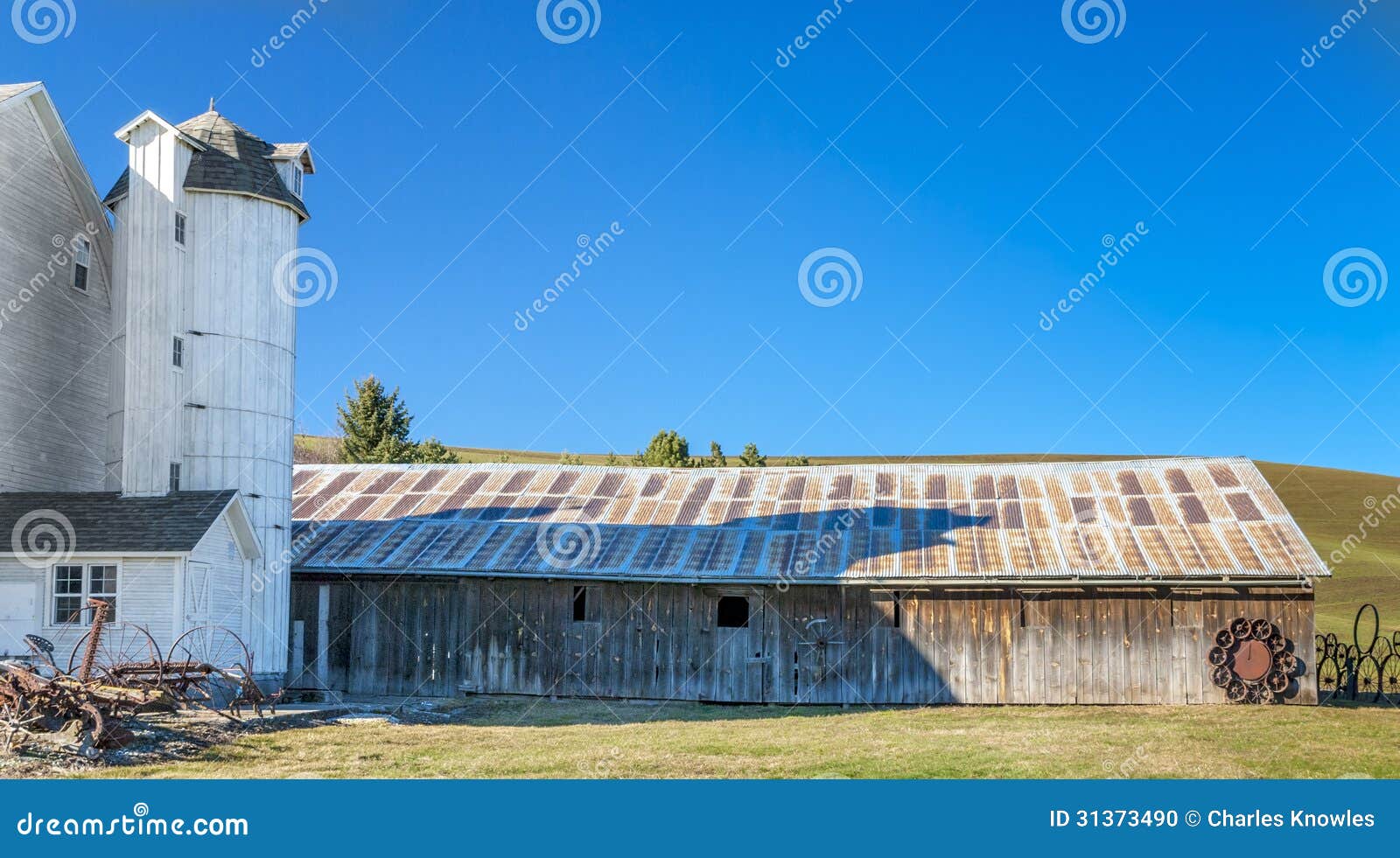 Fancy Old Barn with Wood Silo Stock Photo - Image of wagon, wheels ...