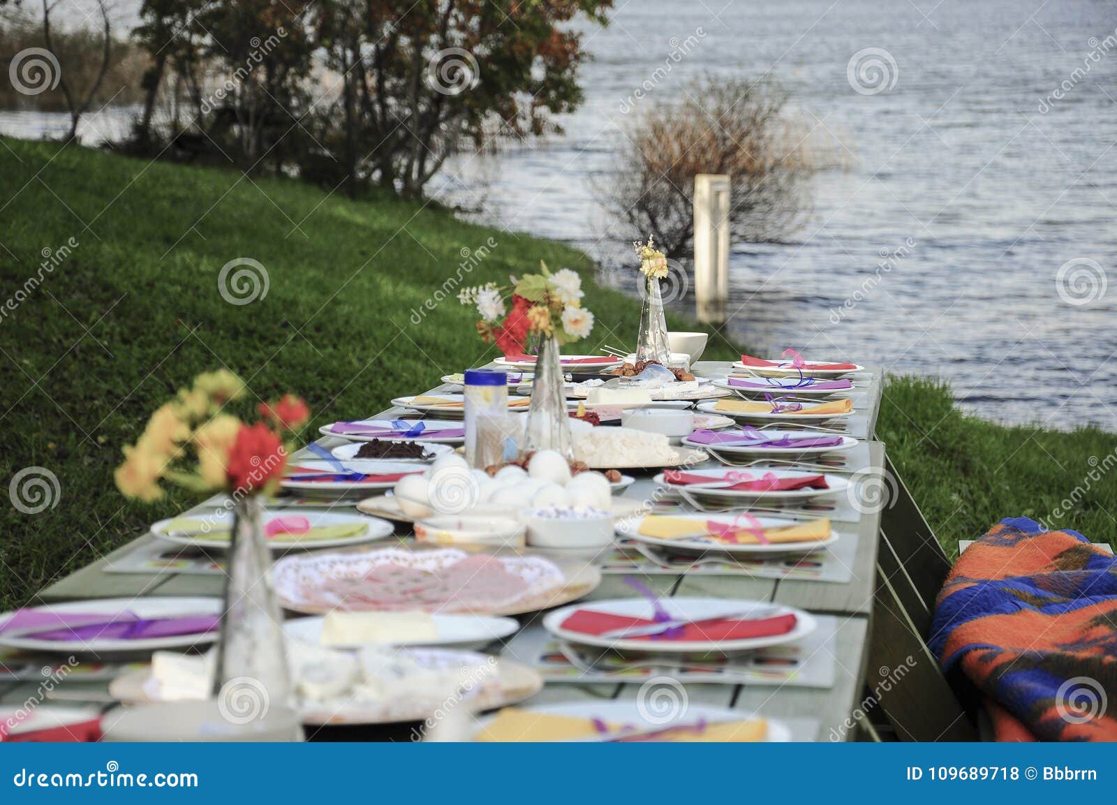 A Fancy Picnic Table Full of Food by Lake in Spring Stock Photo - Image ...