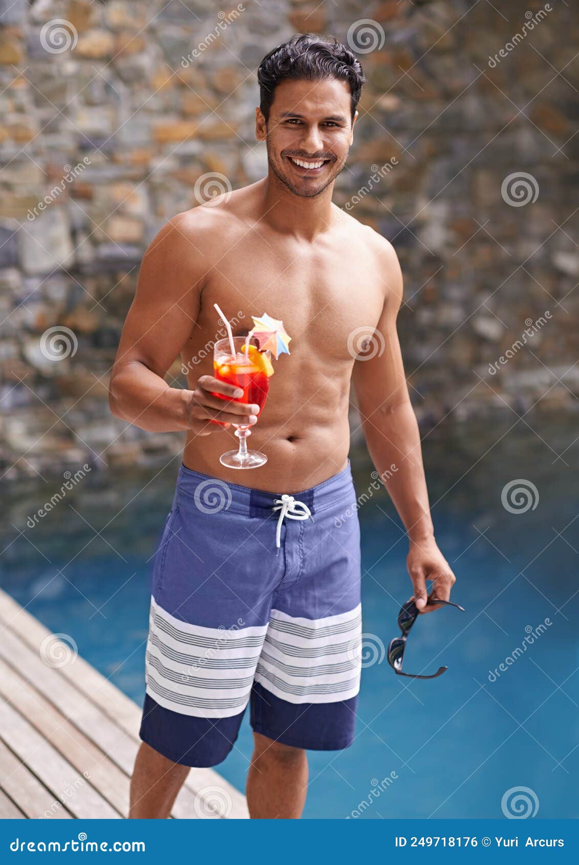 Fancy Sharing this Cocktail. Portrait of a Handsome Man by a Pool ...