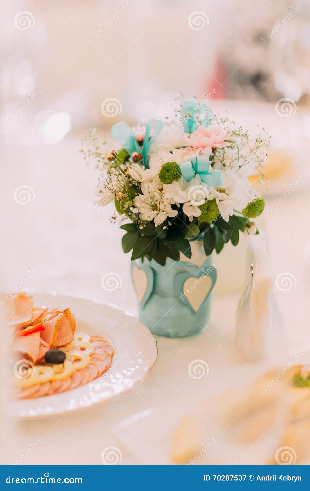Fancy Table Setted for a Wedding Dinner and Decorated with Flowers in ...