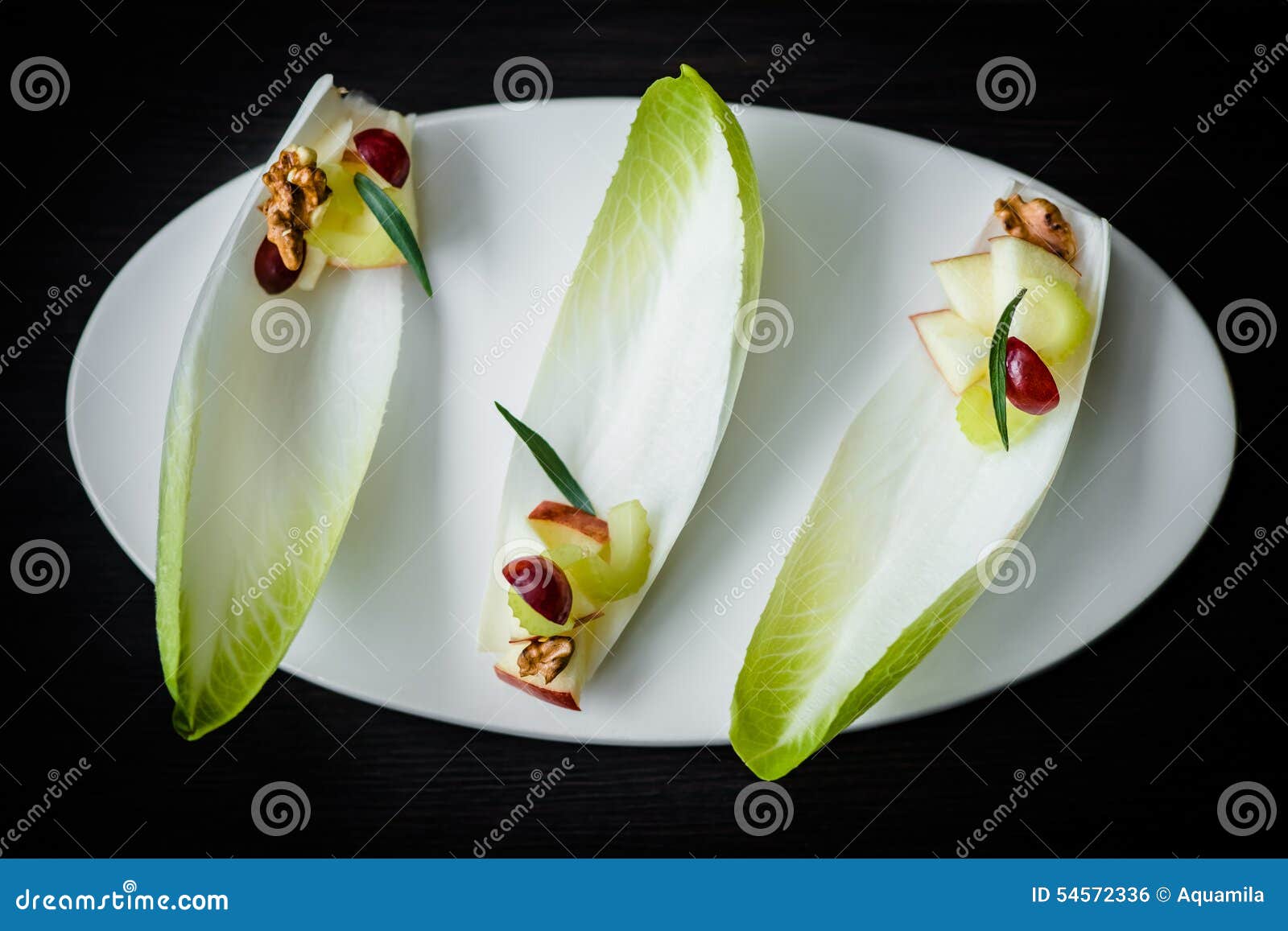 Fancy Waldorf Salad on Endive Leaves Served in Elegant Setting Stock ...